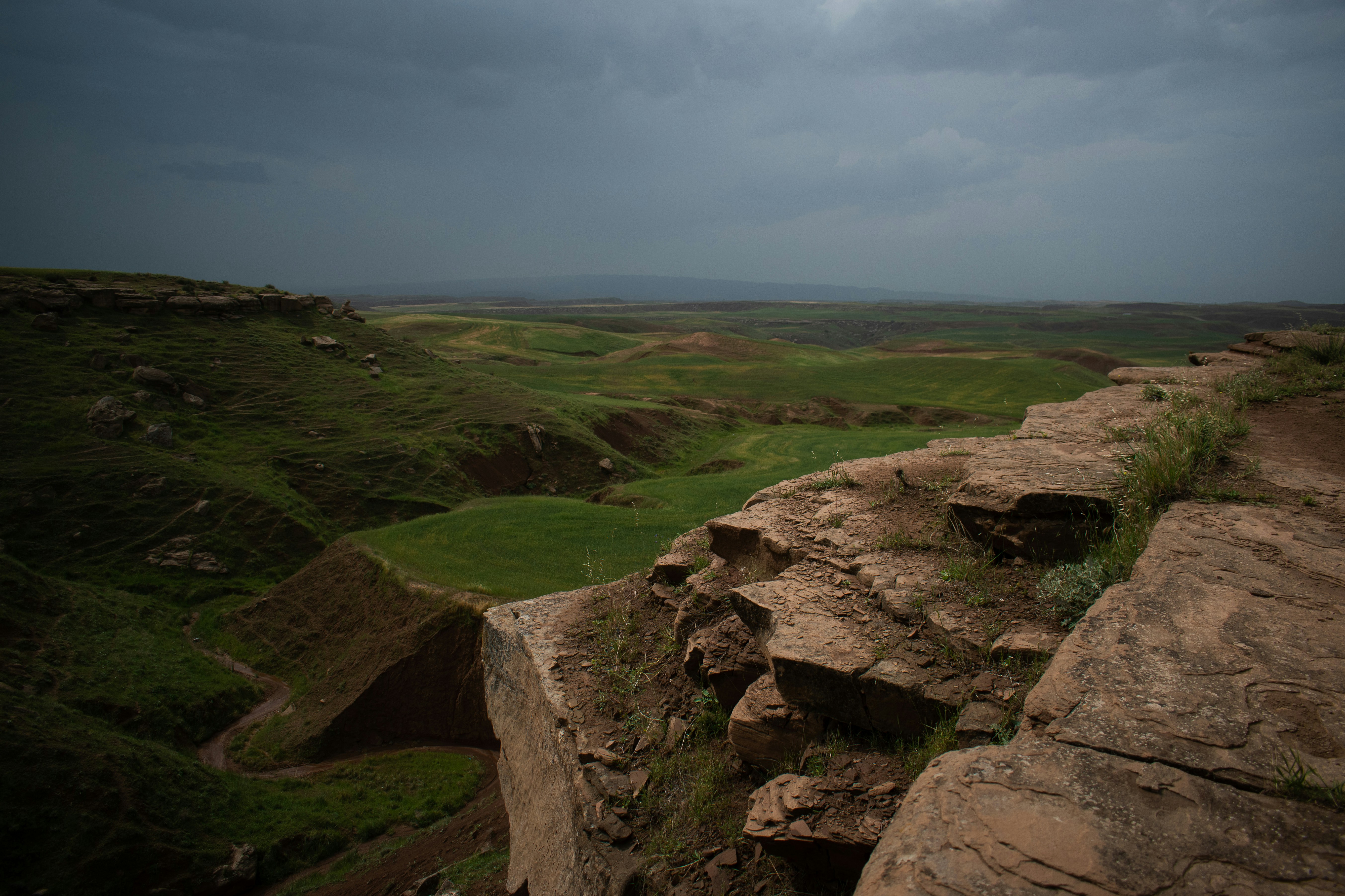 Bold Canyon Edge Under Stormy Skies