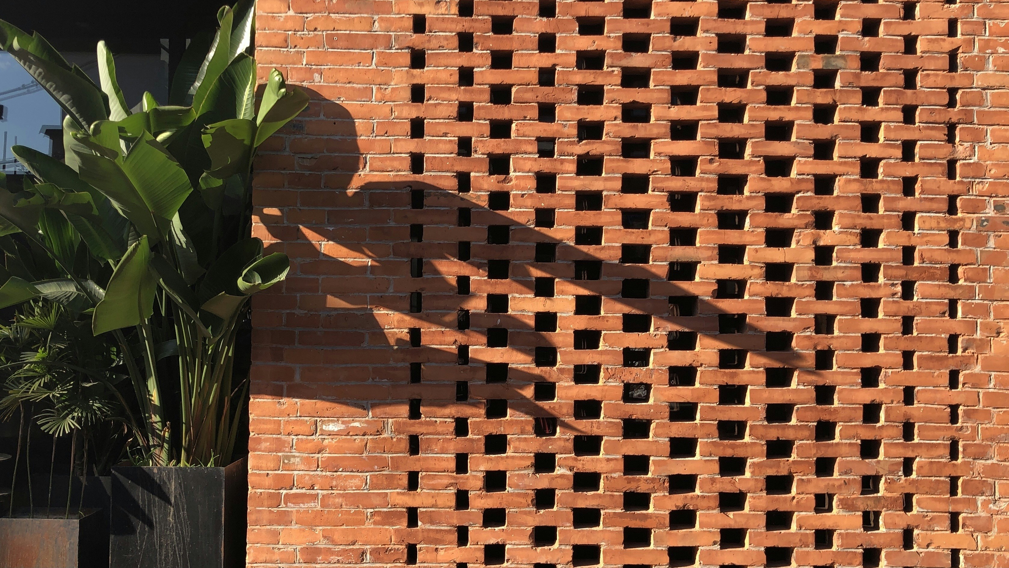 Shadowed Seam: A Brick Wall Script Cast in Sunlight