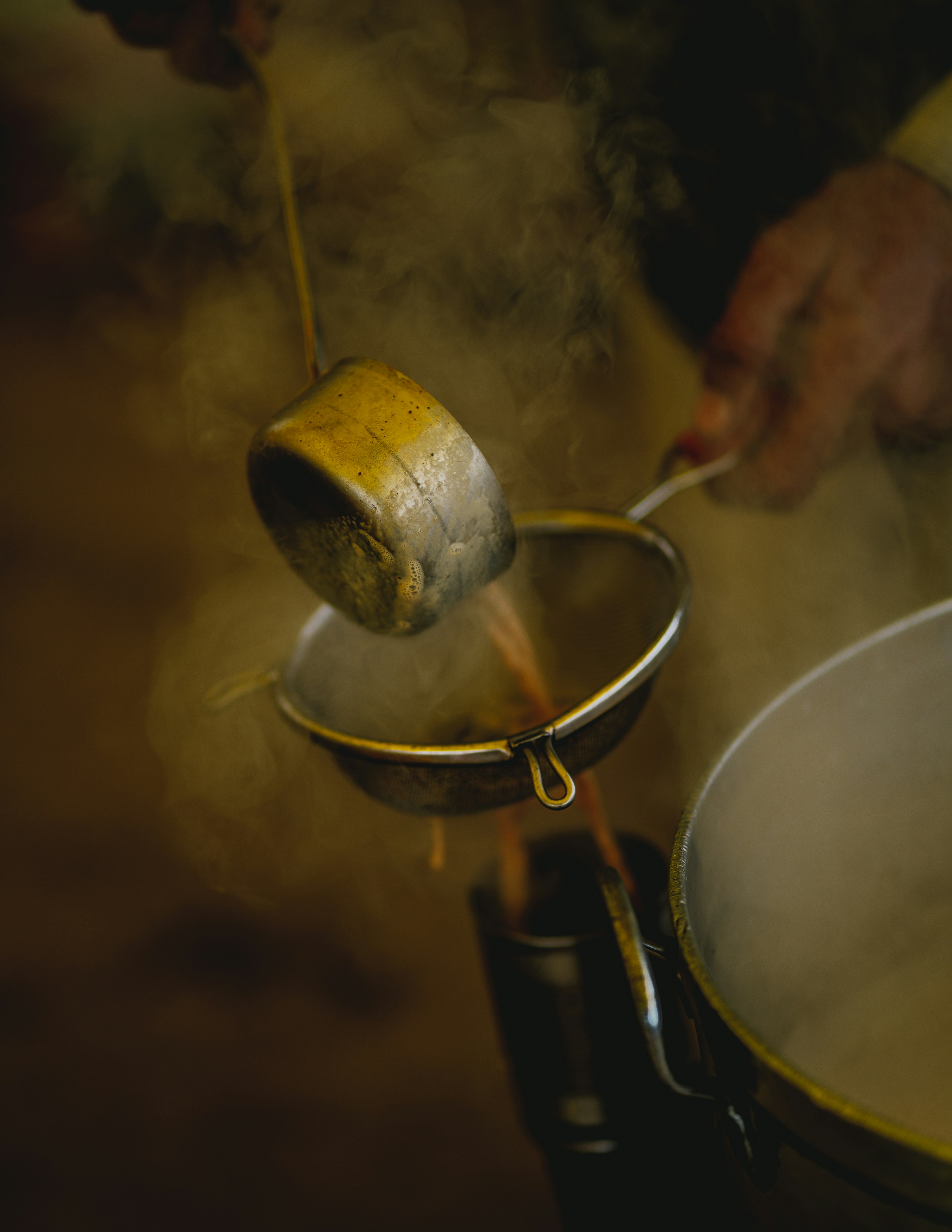 A person stirring a pot on a stove photo – Free New delhi Image on Unsplash