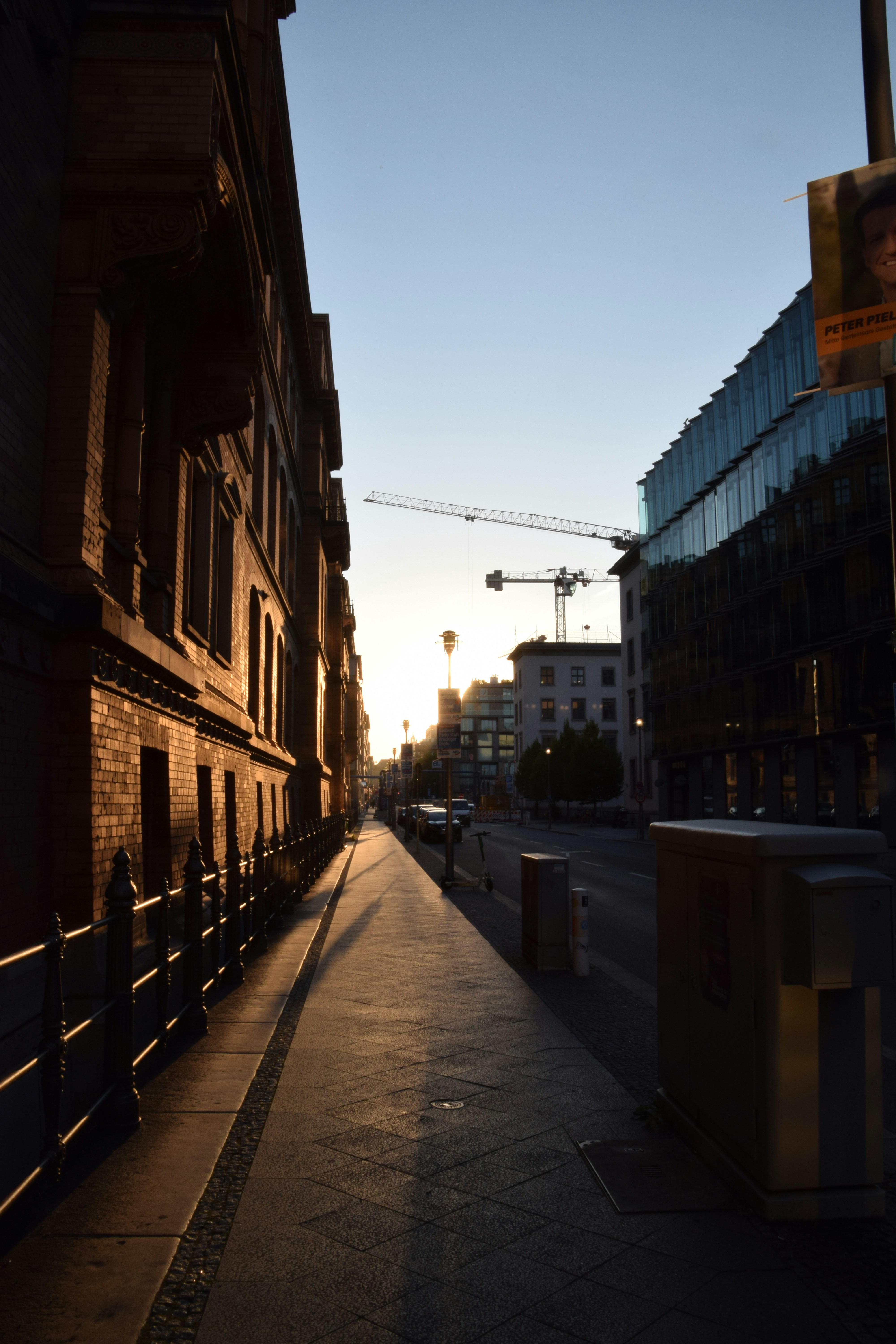 Dusk Spine: A Vanishing Street Between Brick Facades and Glass