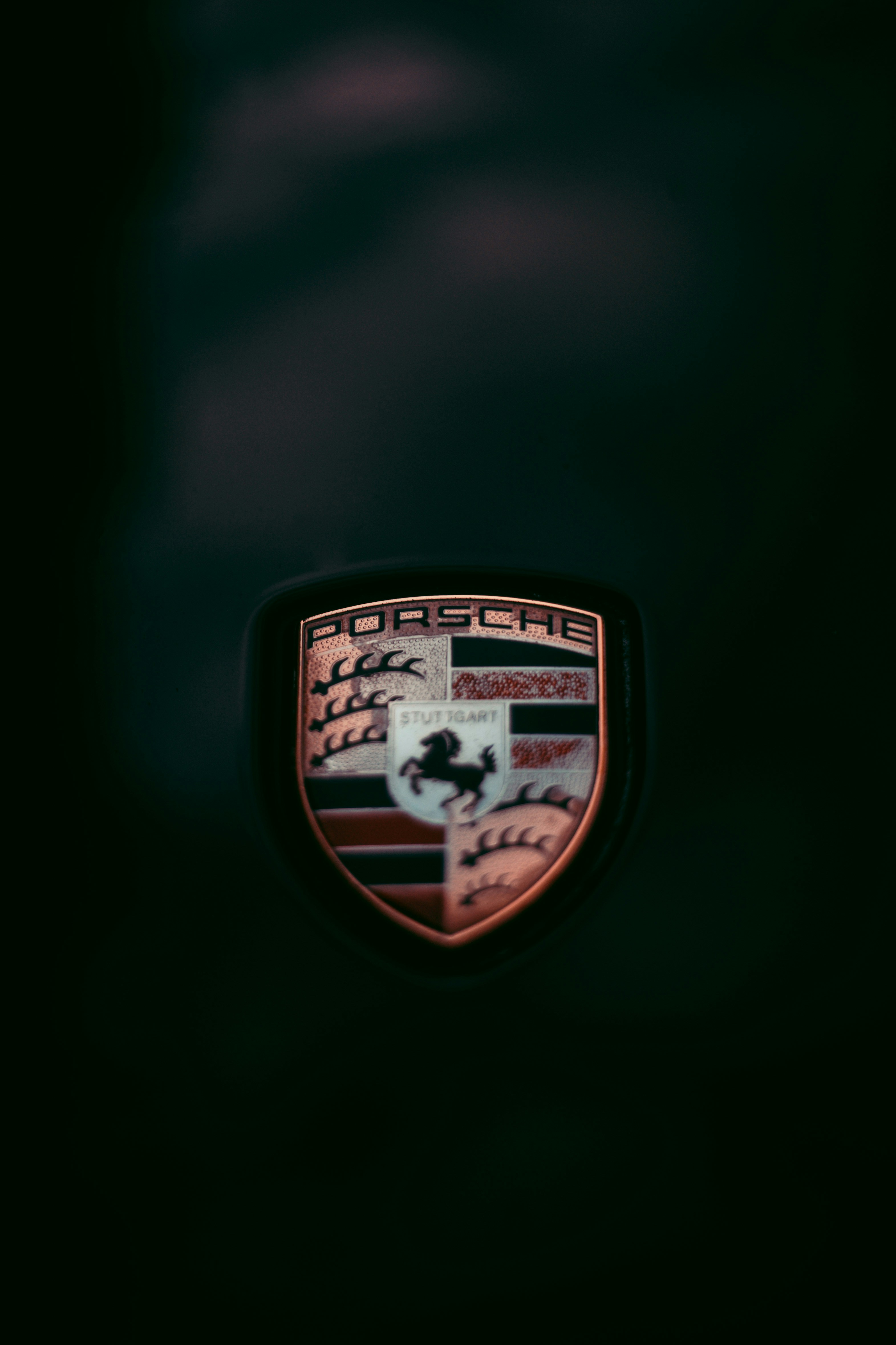 Porsche car logo in a dark mood
