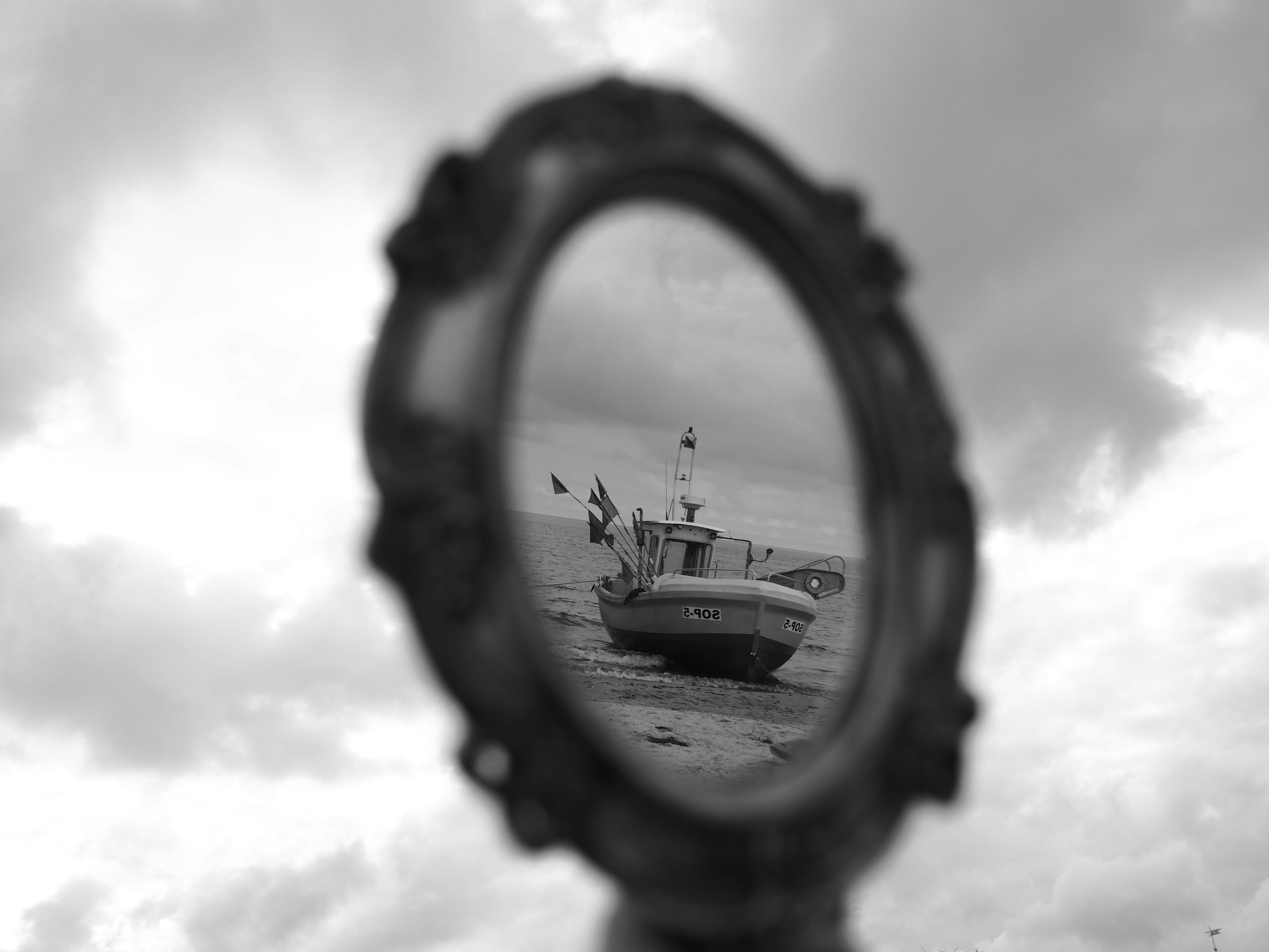 Harbor Reflection in a Timeworn Circular Frame