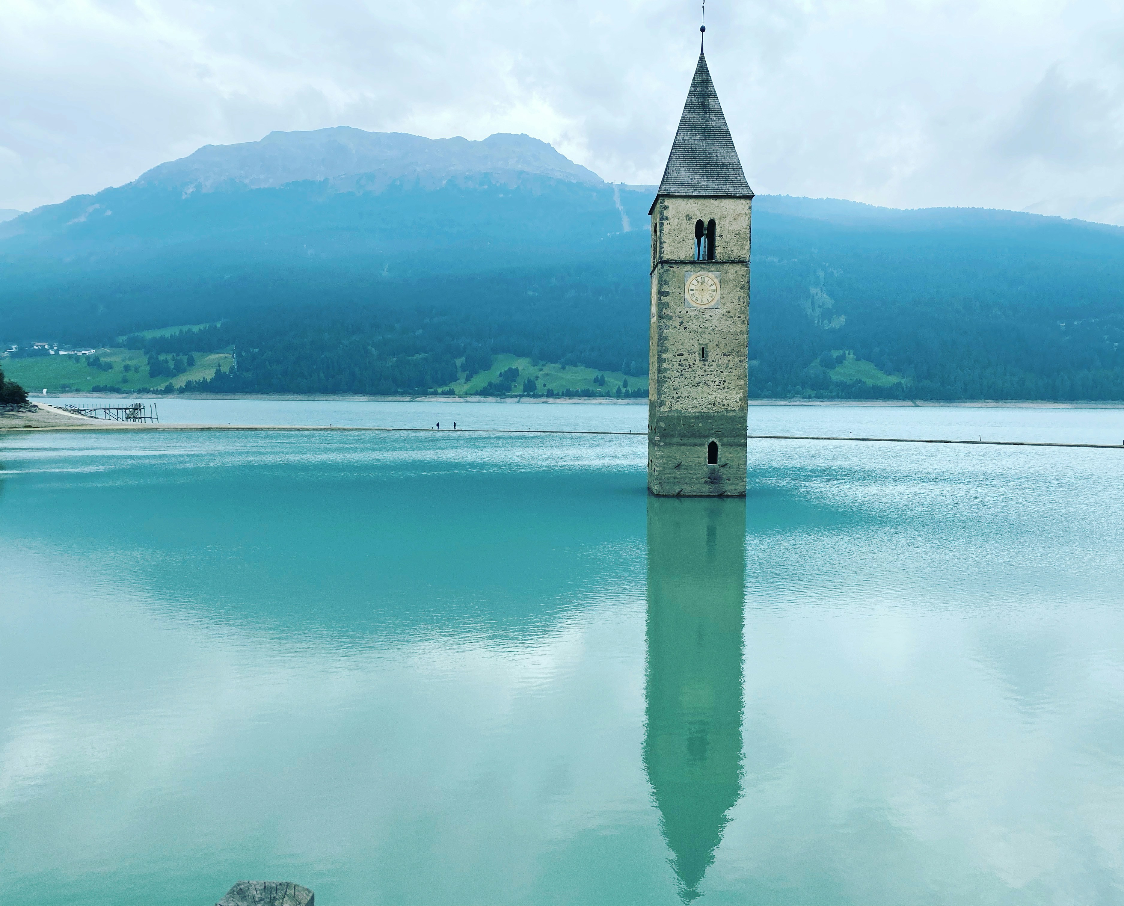 Lone Bell Tower Rising from Teal Stillness