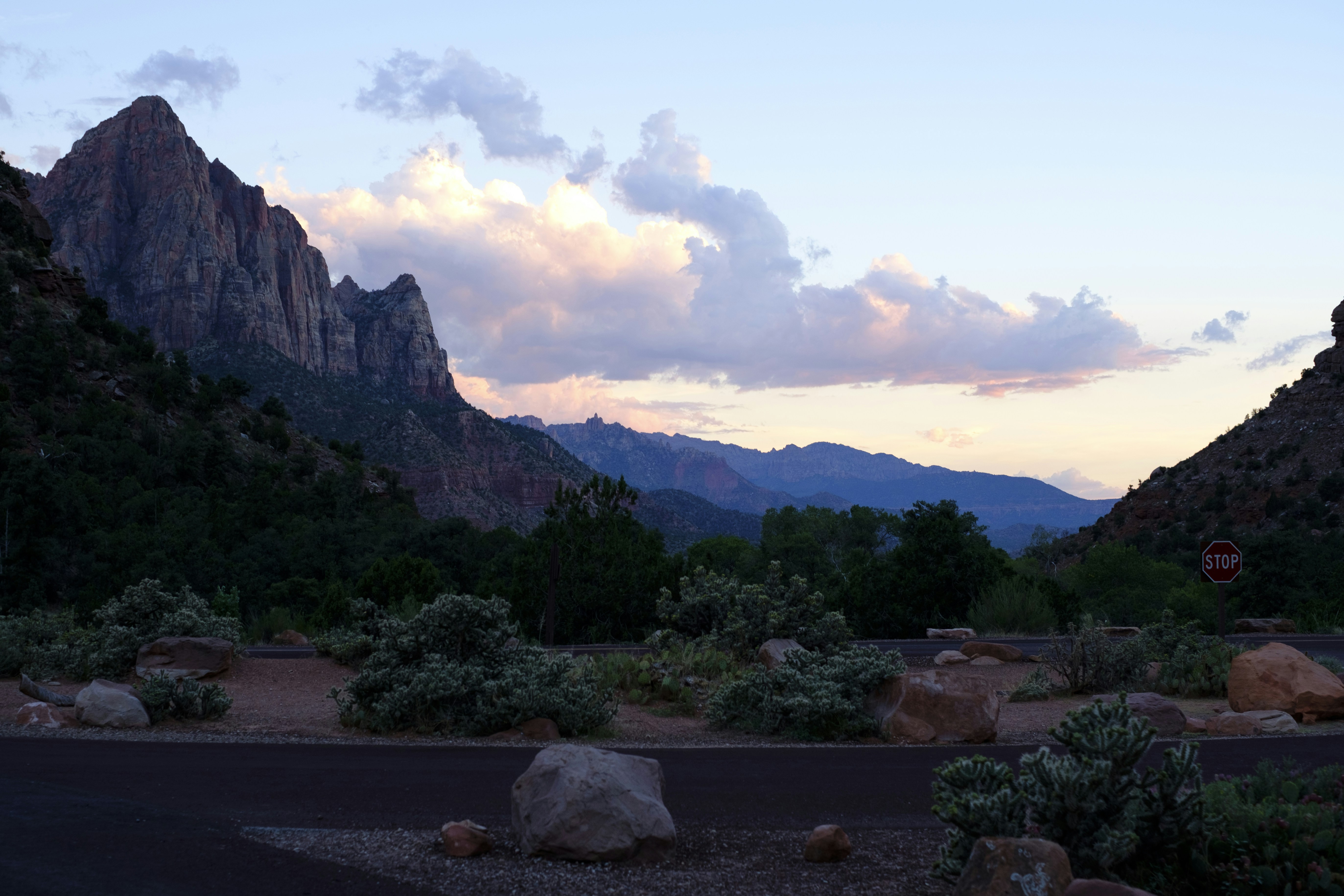 Ridge at Dusk: Clouds Drifting Over a Desert Canyon