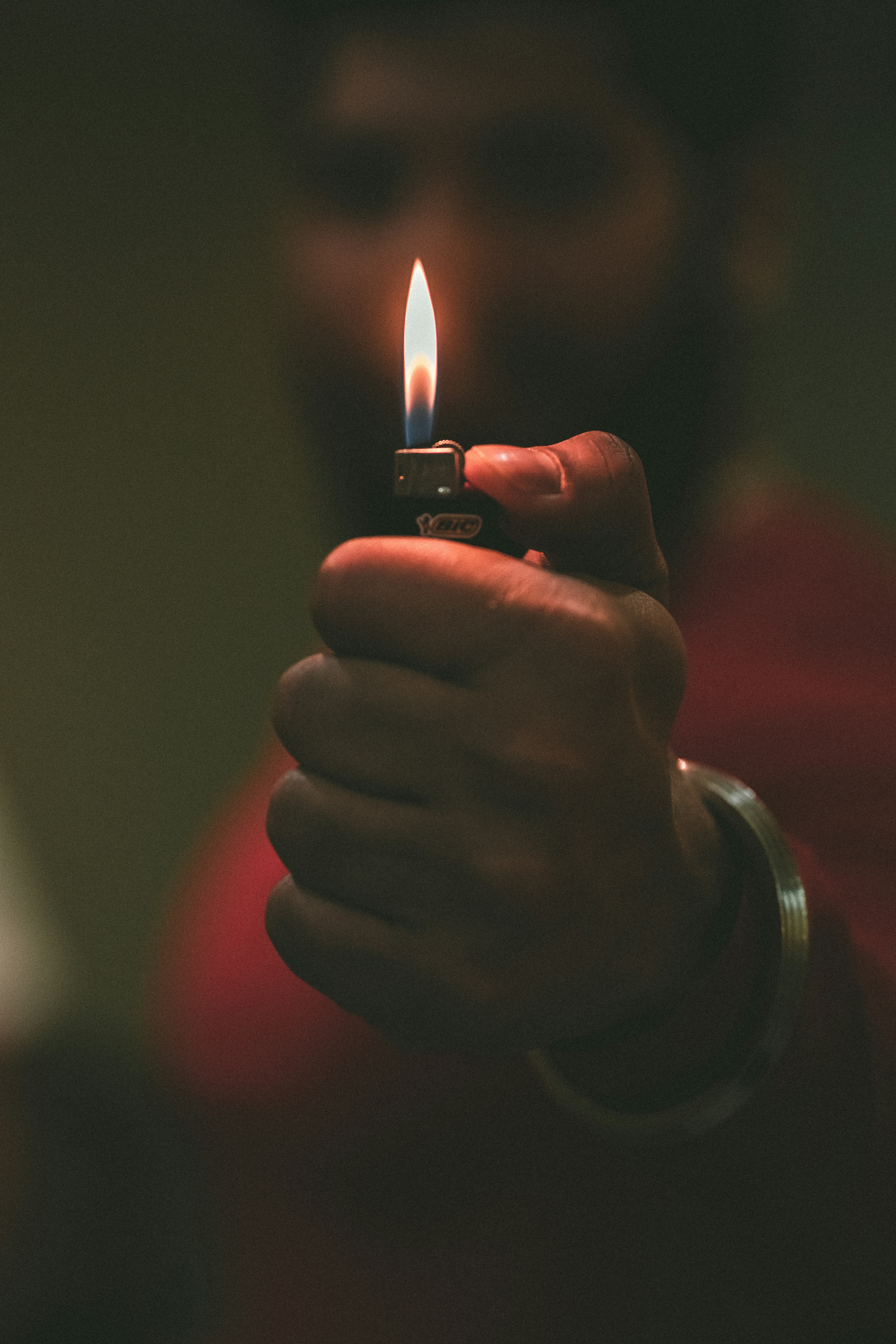 A man holding a lighter in his hand photo – Free Human Image on Unsplash