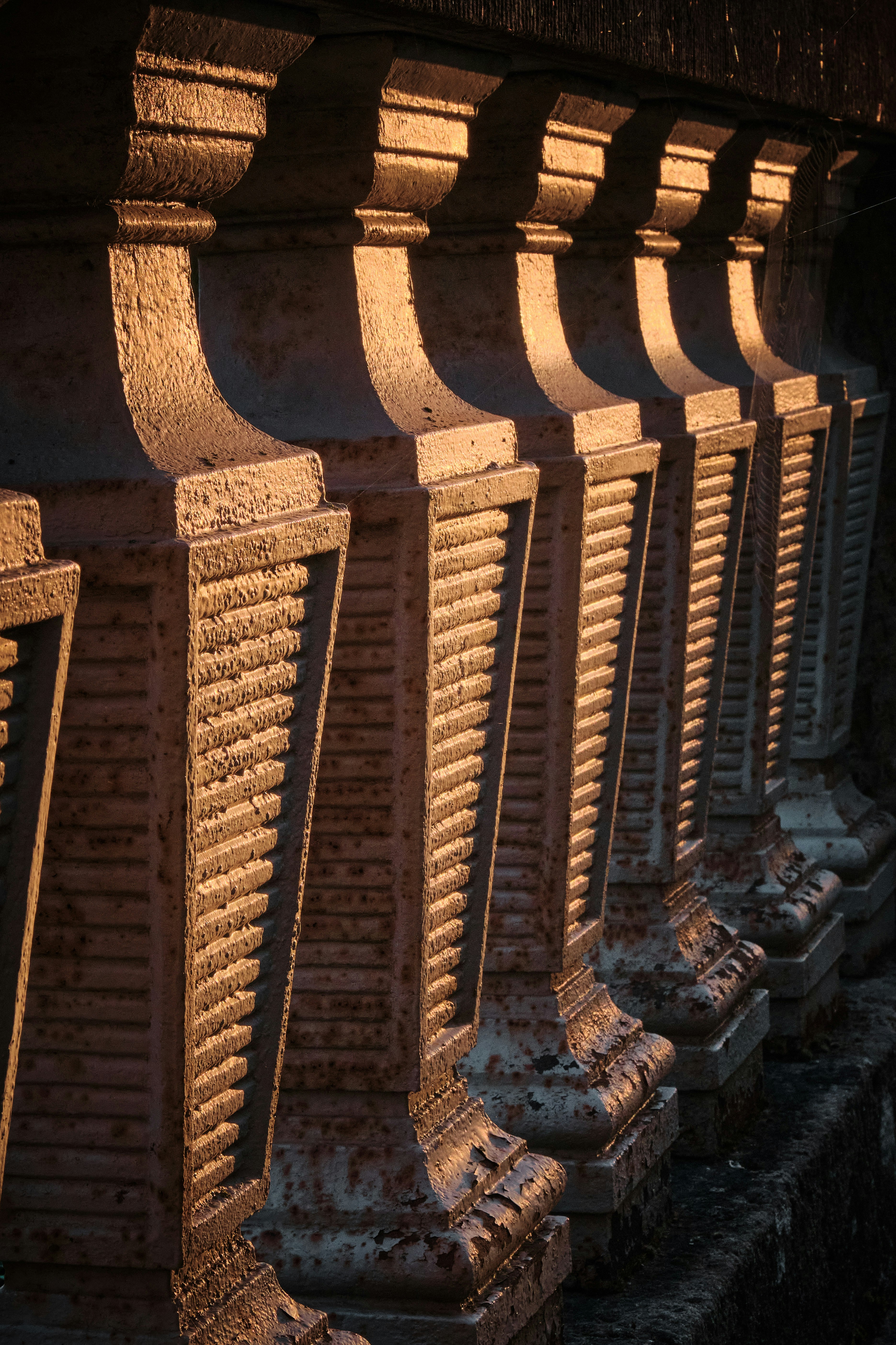 Sunlit Carved Shadows Along an Ancient Ledge