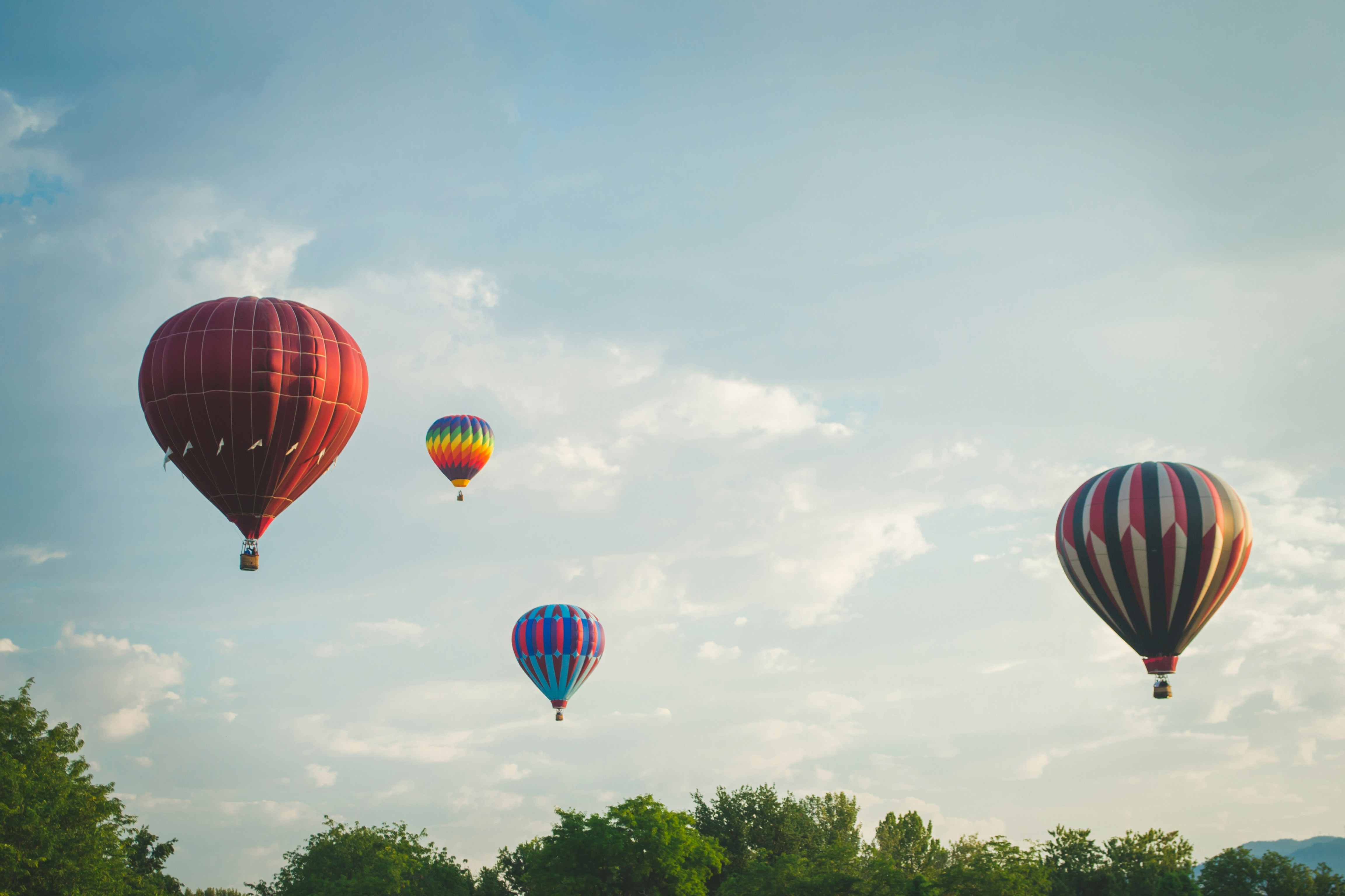 A group of hot air balloons flying in the sky photo – Free Boise Image ...
