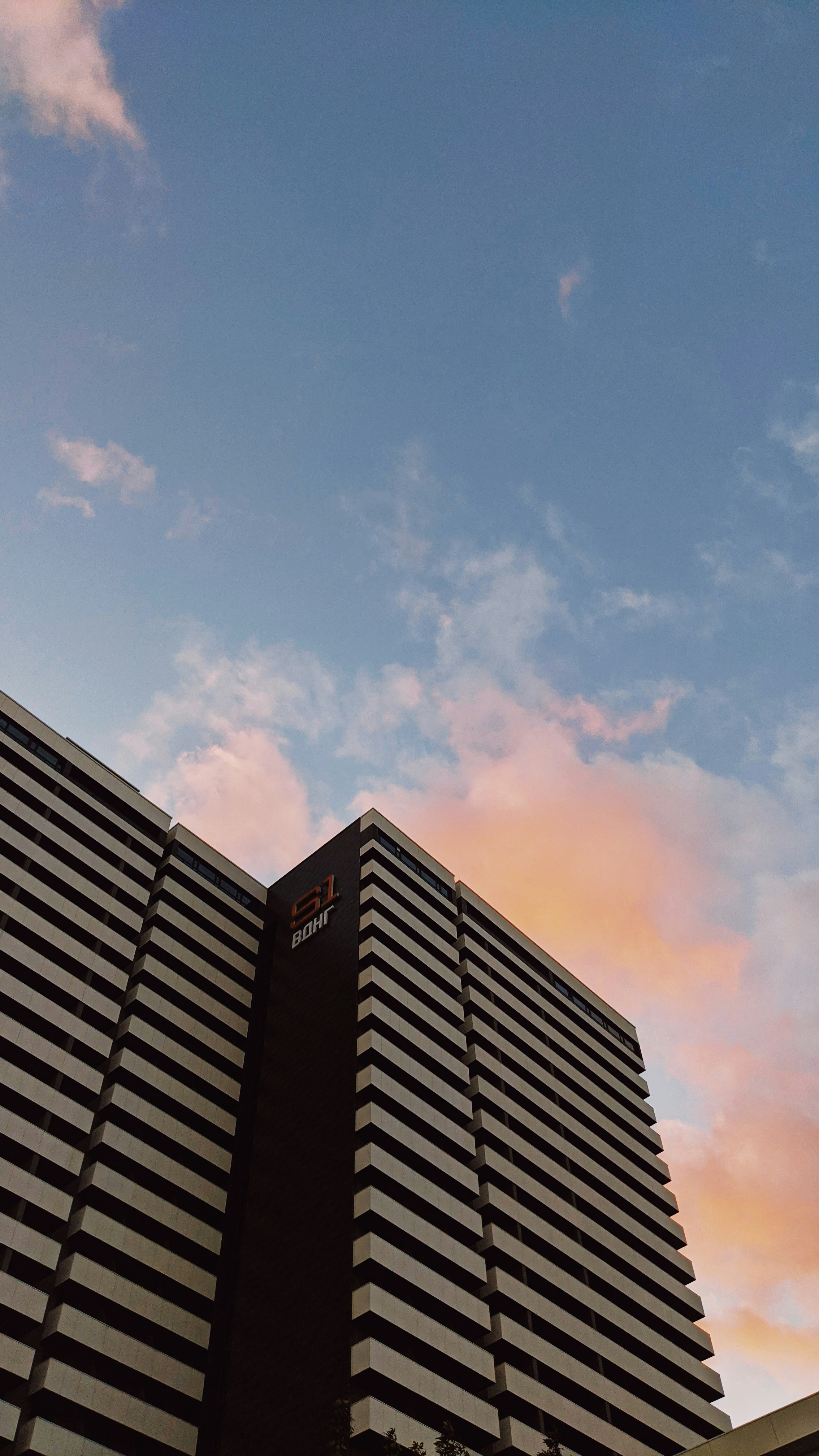 Sunset Onward: The Cornered Sky Above a Modern Crest