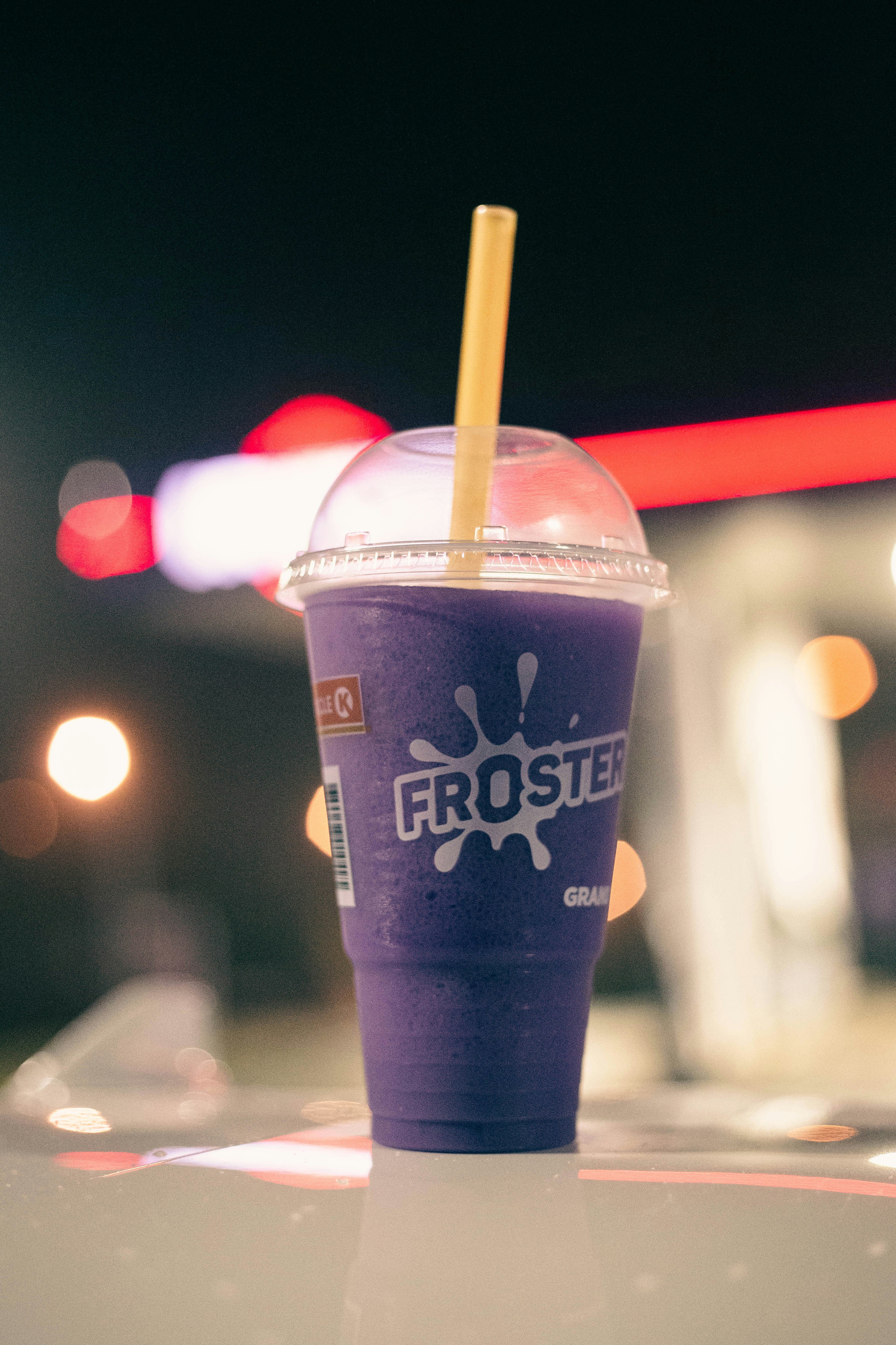 A purple frosted drink with a straw in it photo – Free Beverage Image ...