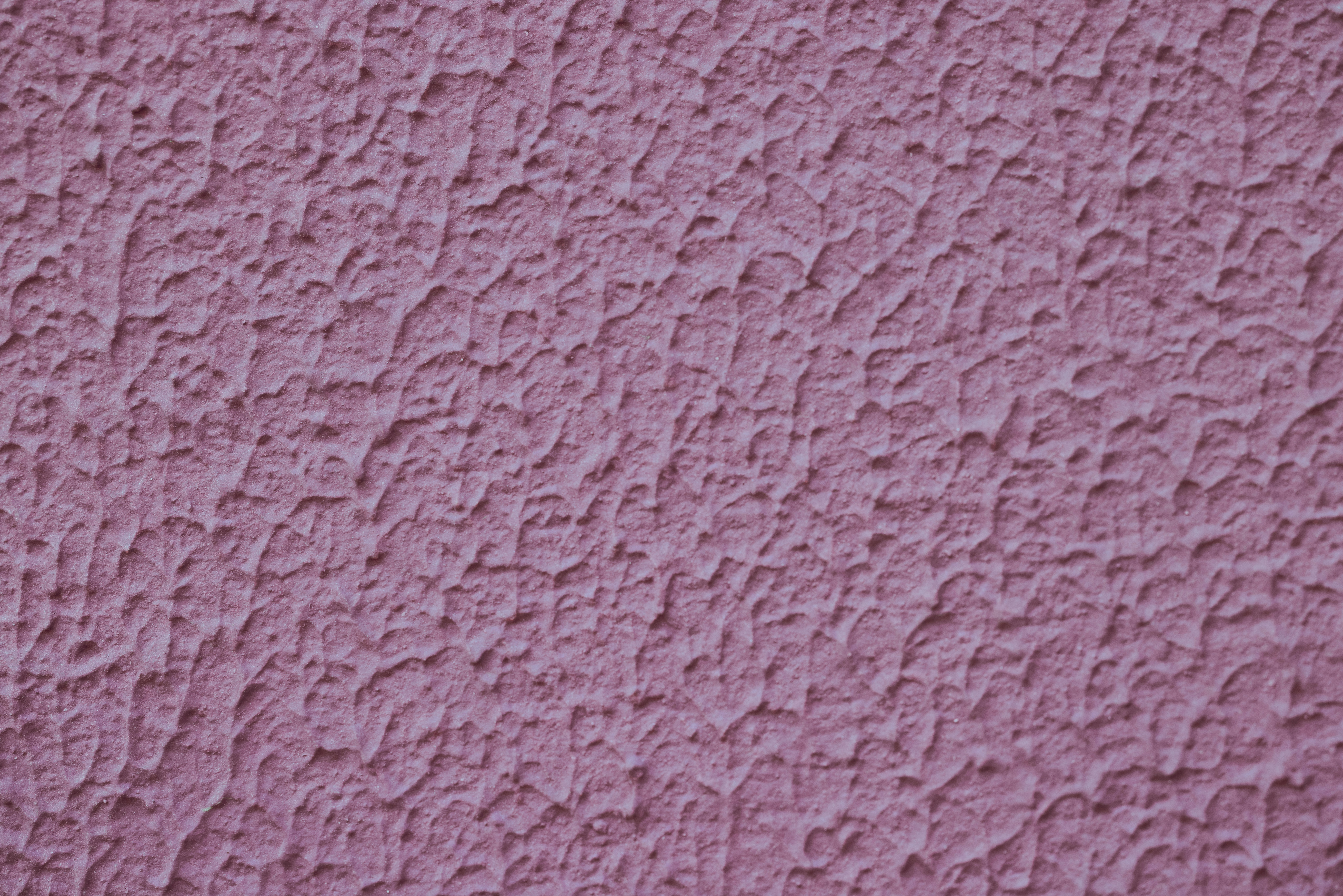 A close up of a pink stucco wall photo – Free Texture Image on Unsplash