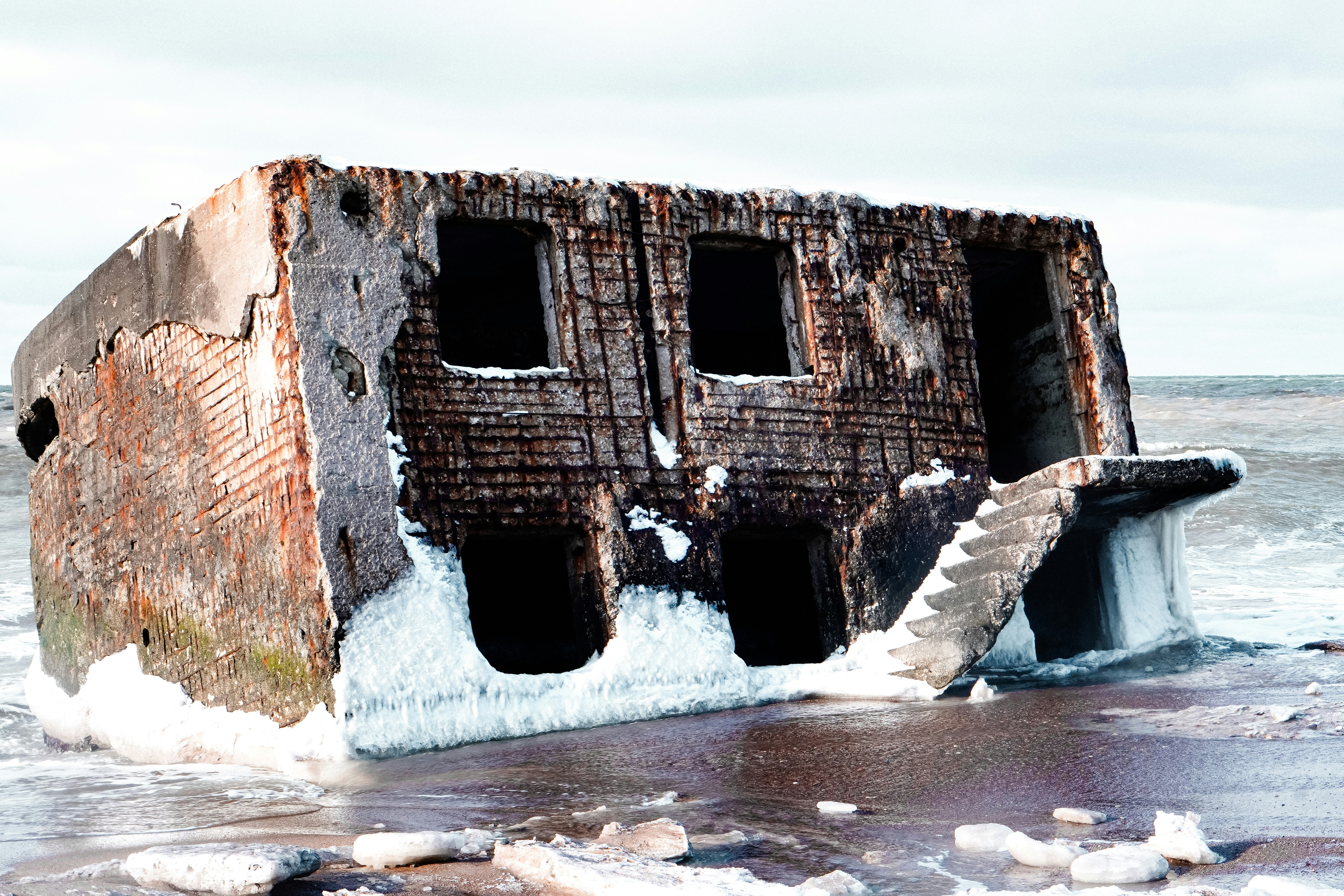 Sea-Walled Vestige: Frost-Touched Ruin Emerges from the Tide