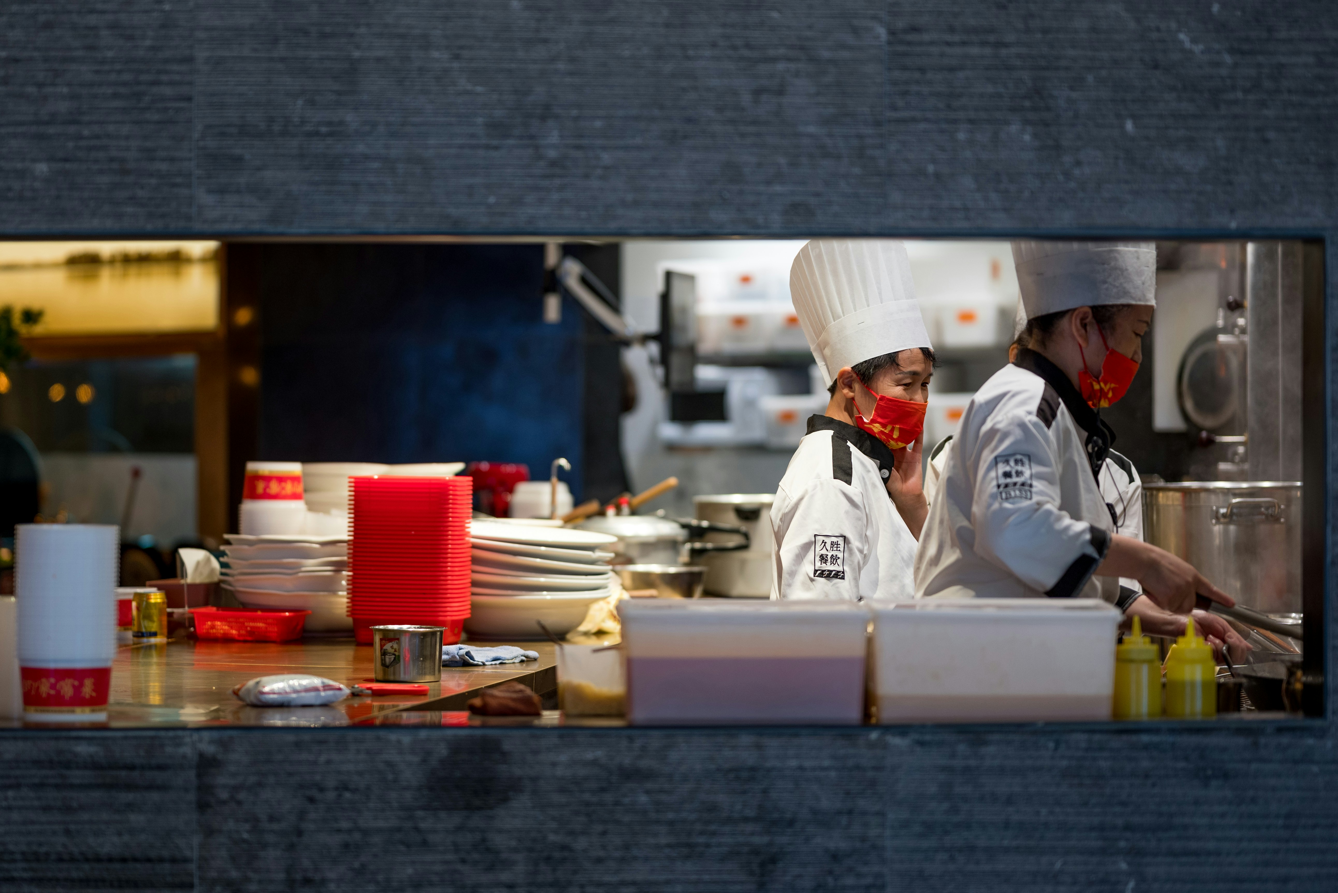 Steam, Silhouettes, and Sauce: Behind the Windowed Kitchen