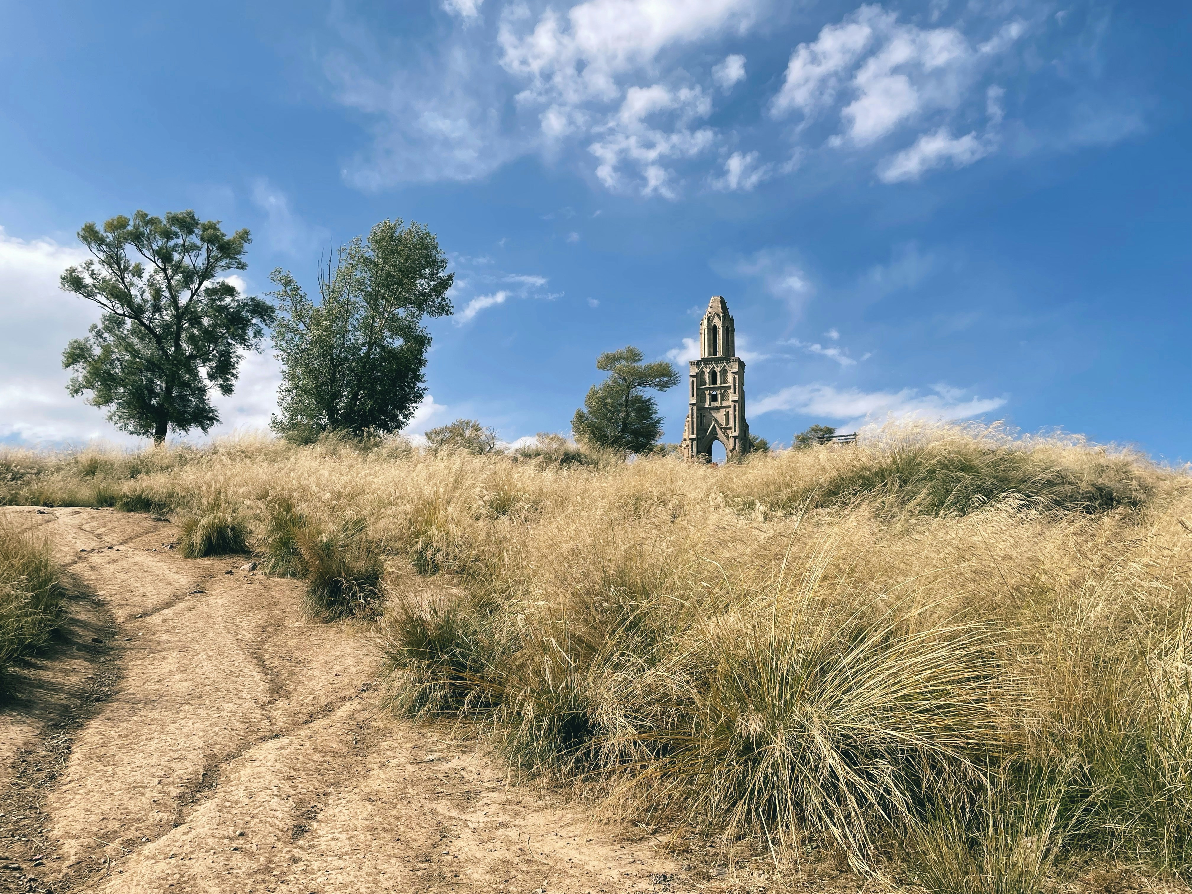 Hilltop Ruin on a Wind-Scattered Meadow