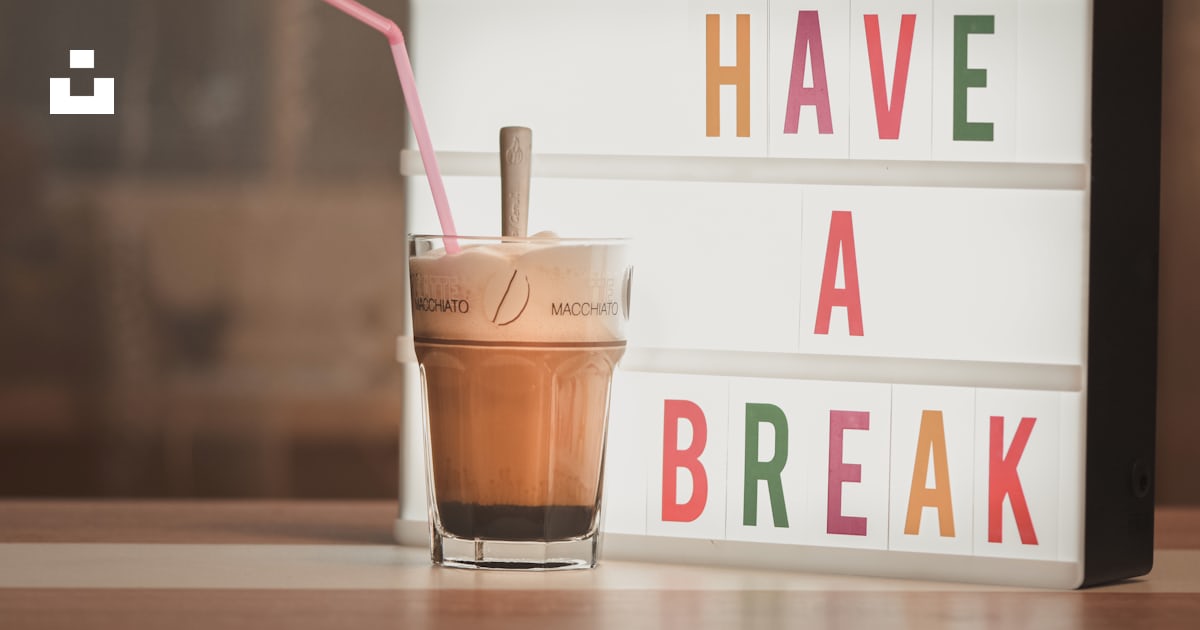 A Drink Sitting Next To A Sign That Says Have A Break Photo Free Pause Image On Unsplash