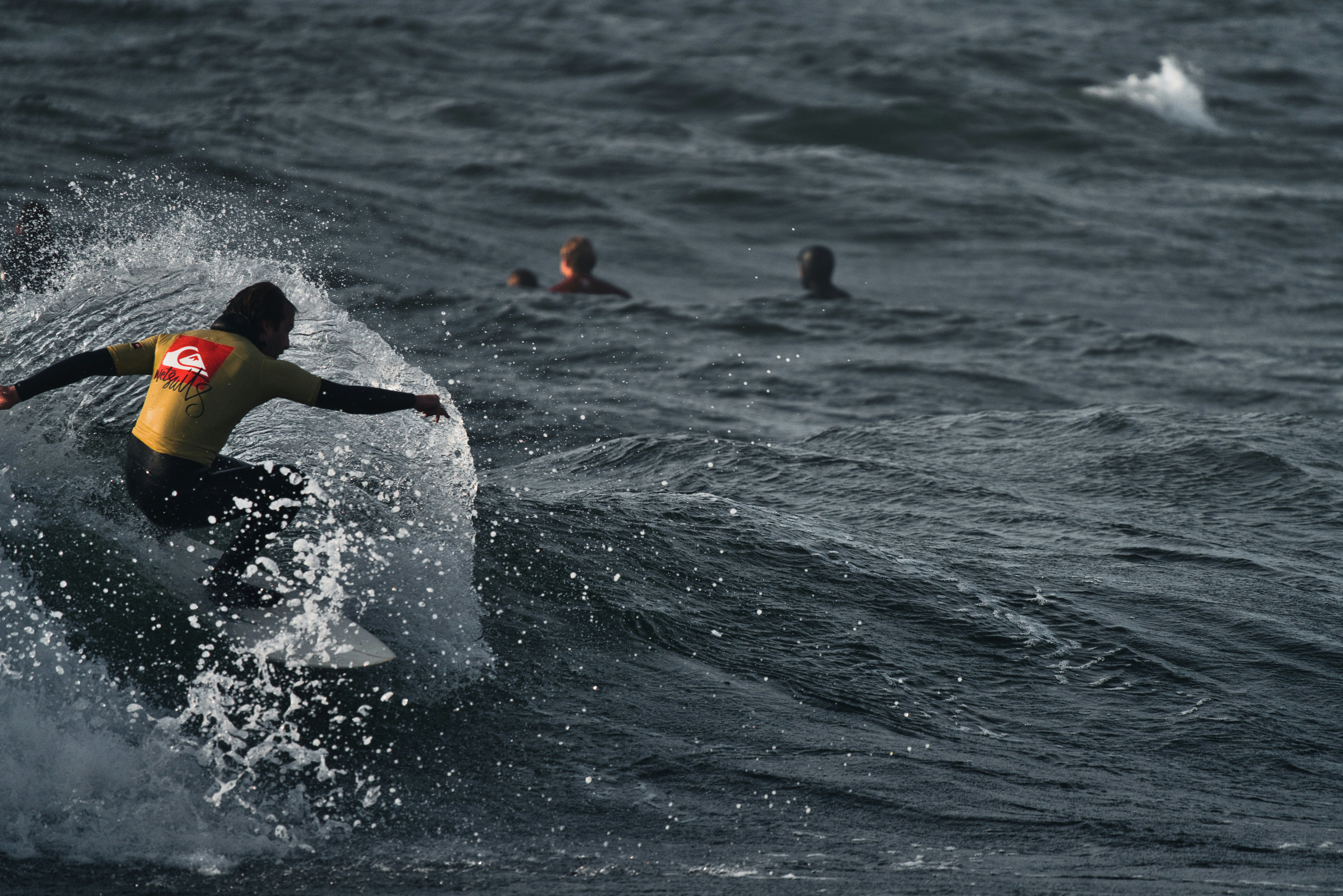 Arc and Spray: Surfer Carves a Cresting Wave