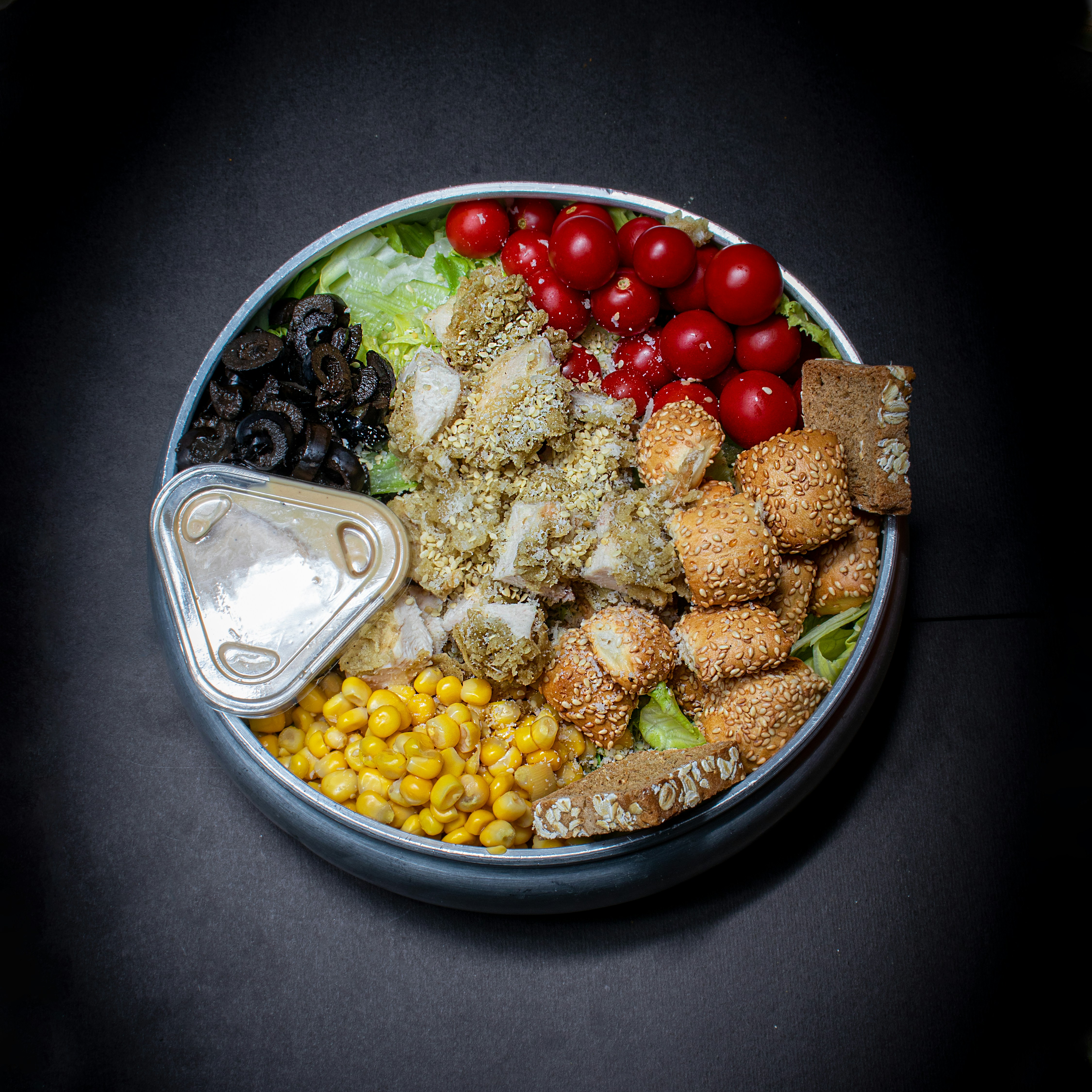 A plate of food that includes corn, tomatoes, lettuce, tomatoes, photo ...