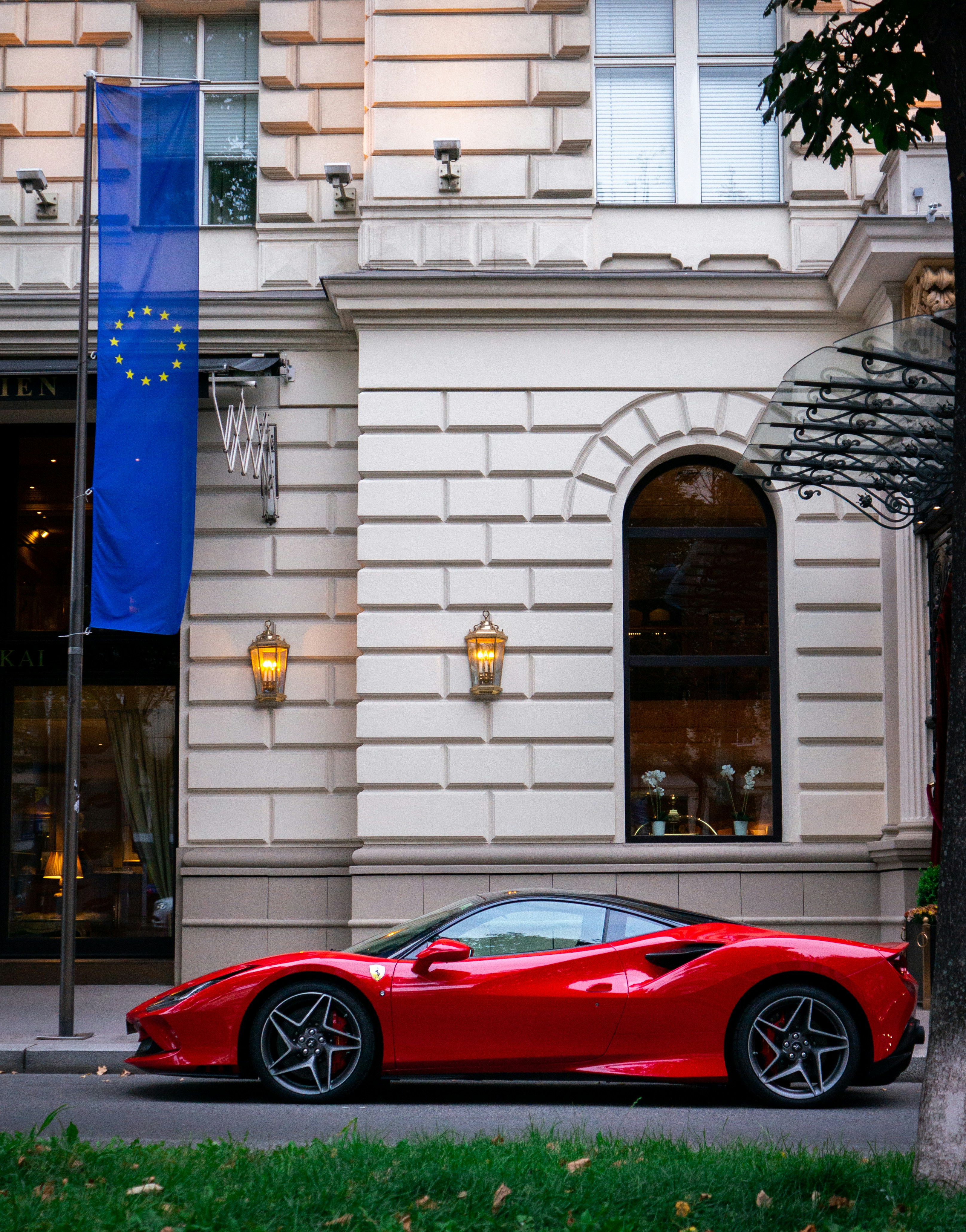 Crimson Veloce by the Beaux-Arts Facade