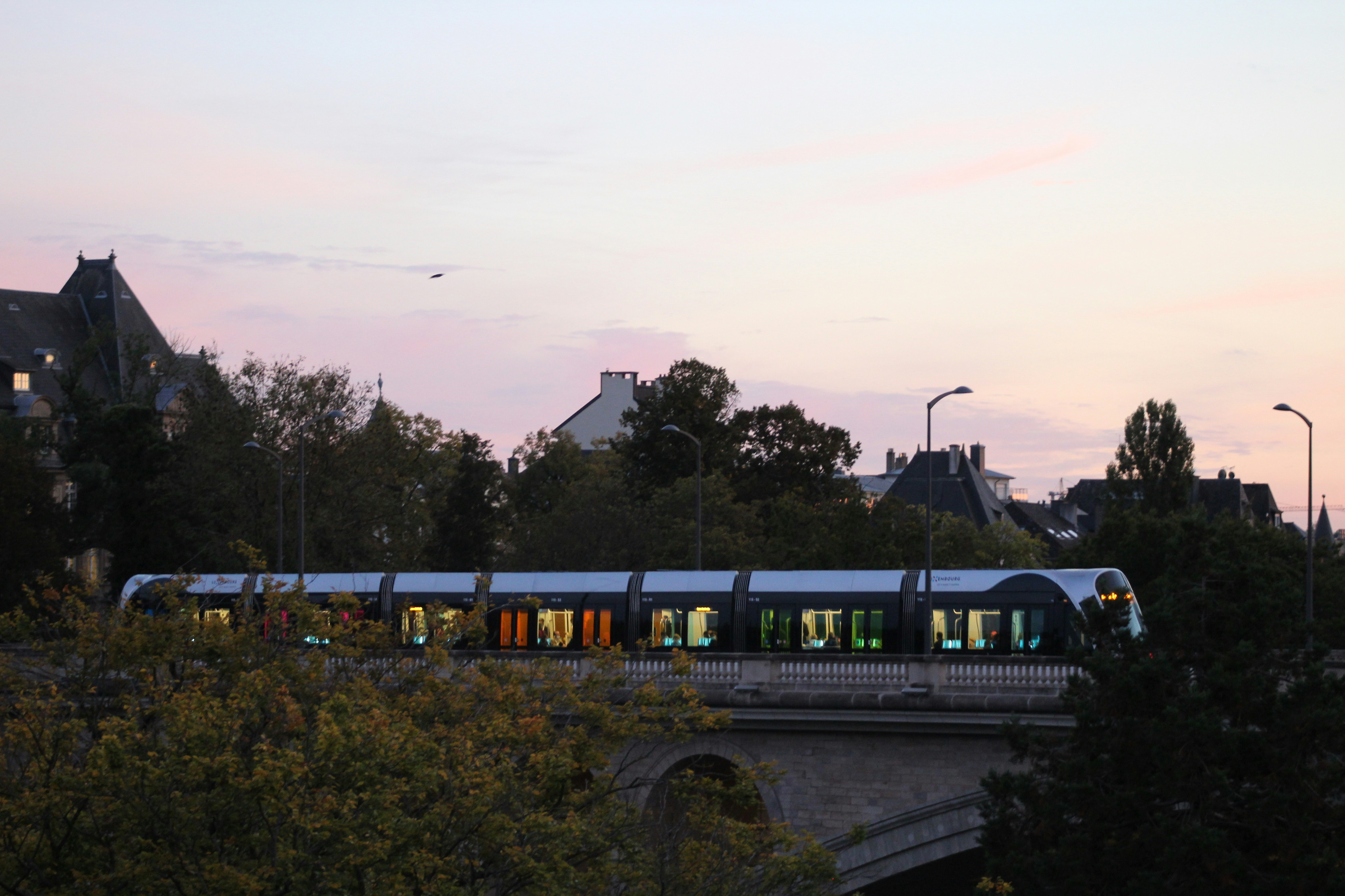 Evening Metro Glide Across the Riverbank