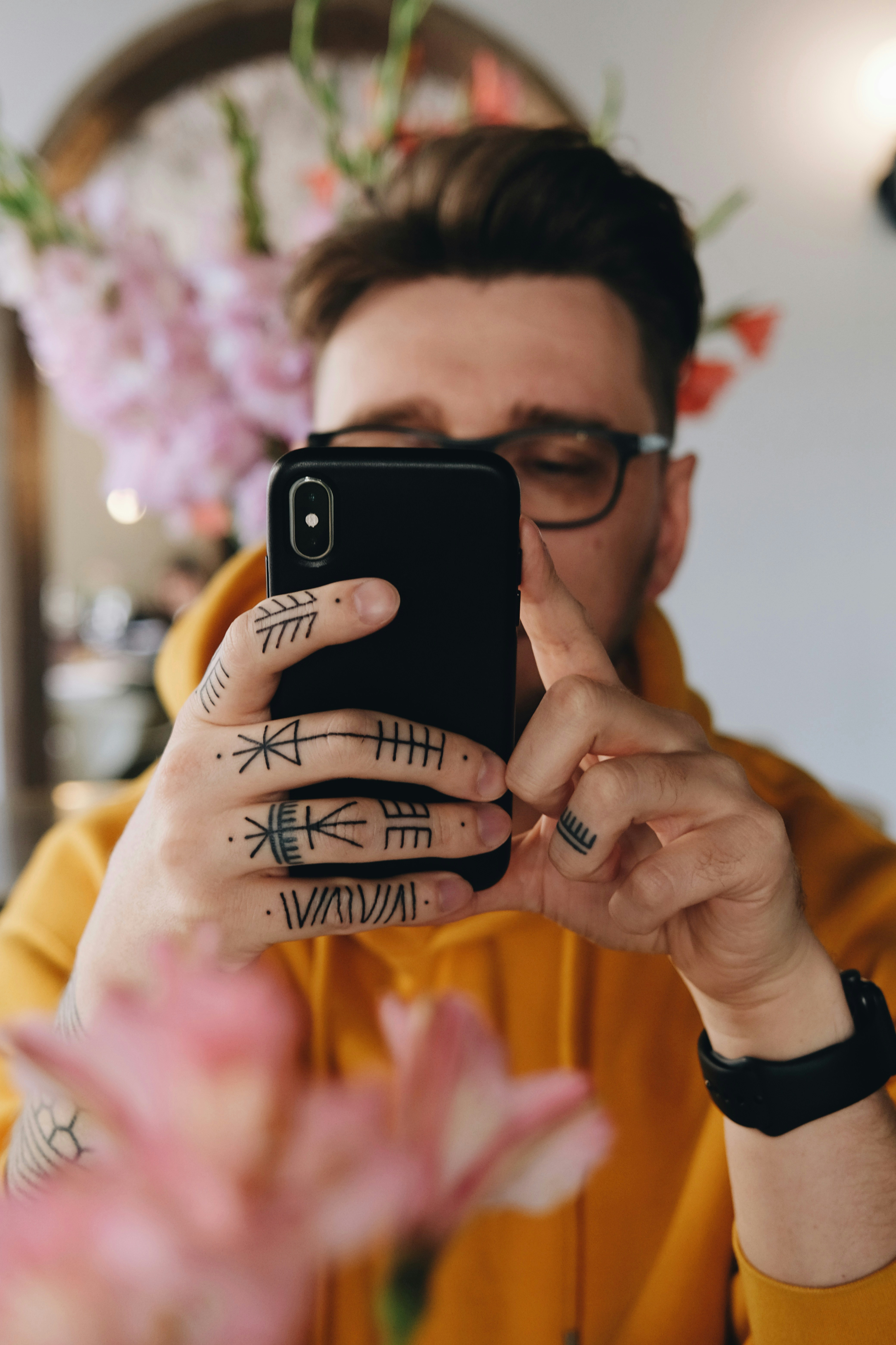a man taking a picture of himself with his phone
