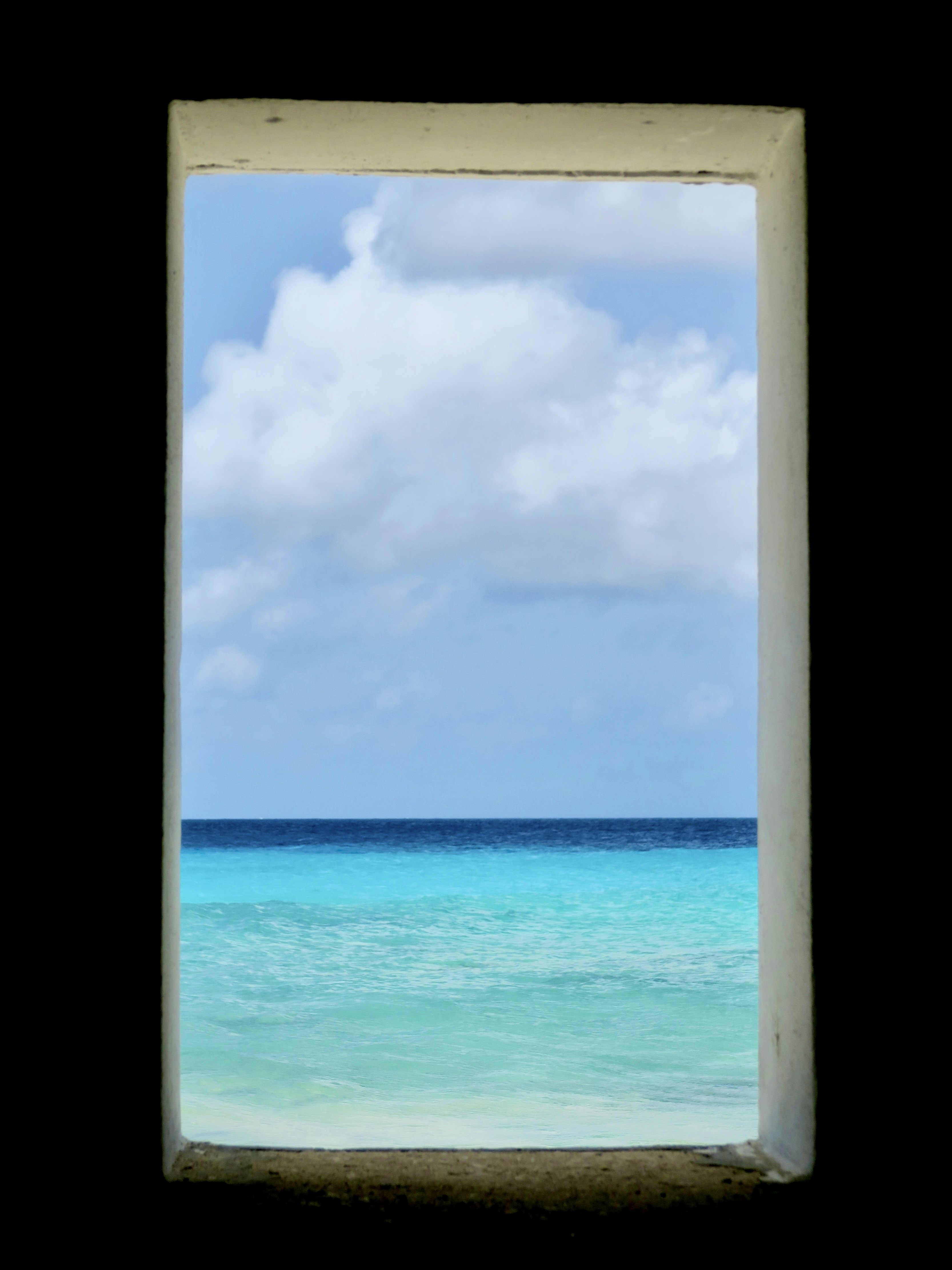 A view of the ocean through a window photo – Free Bonaire Image on Unsplash