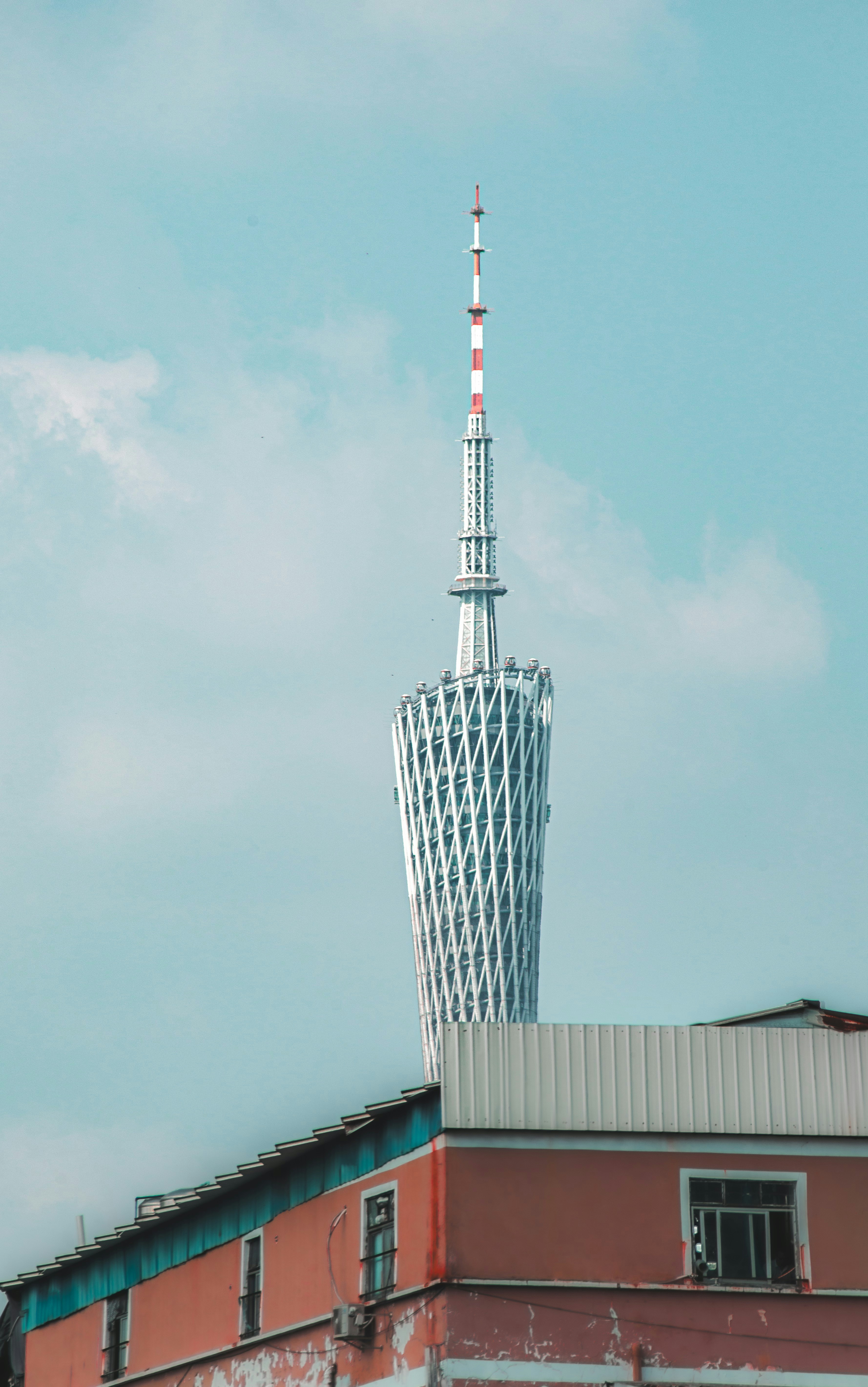 A tall building with a spire on top of it photo – Free Guangzhou Image ...