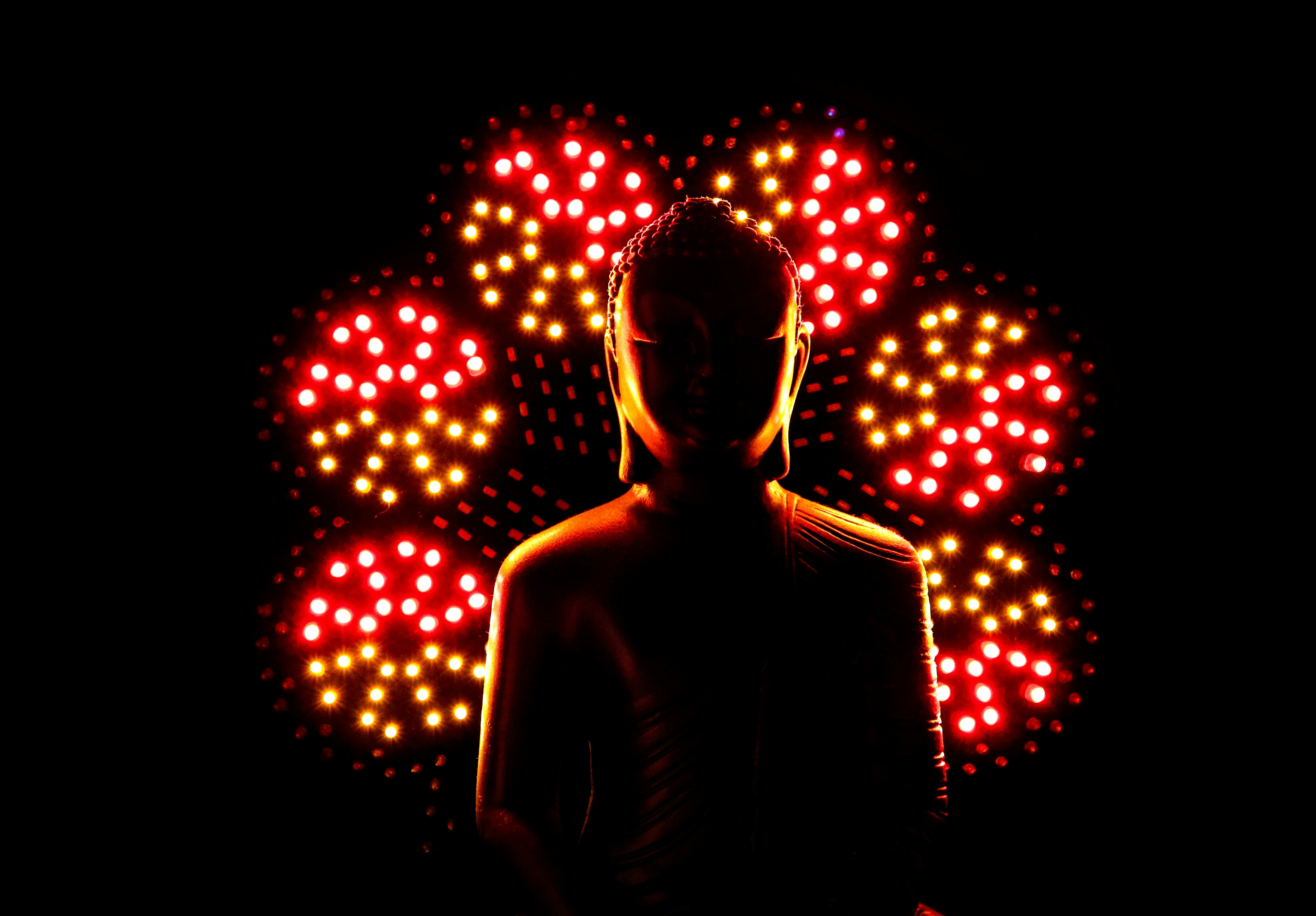 Backlit Silhouette Beneath a Firework Halo