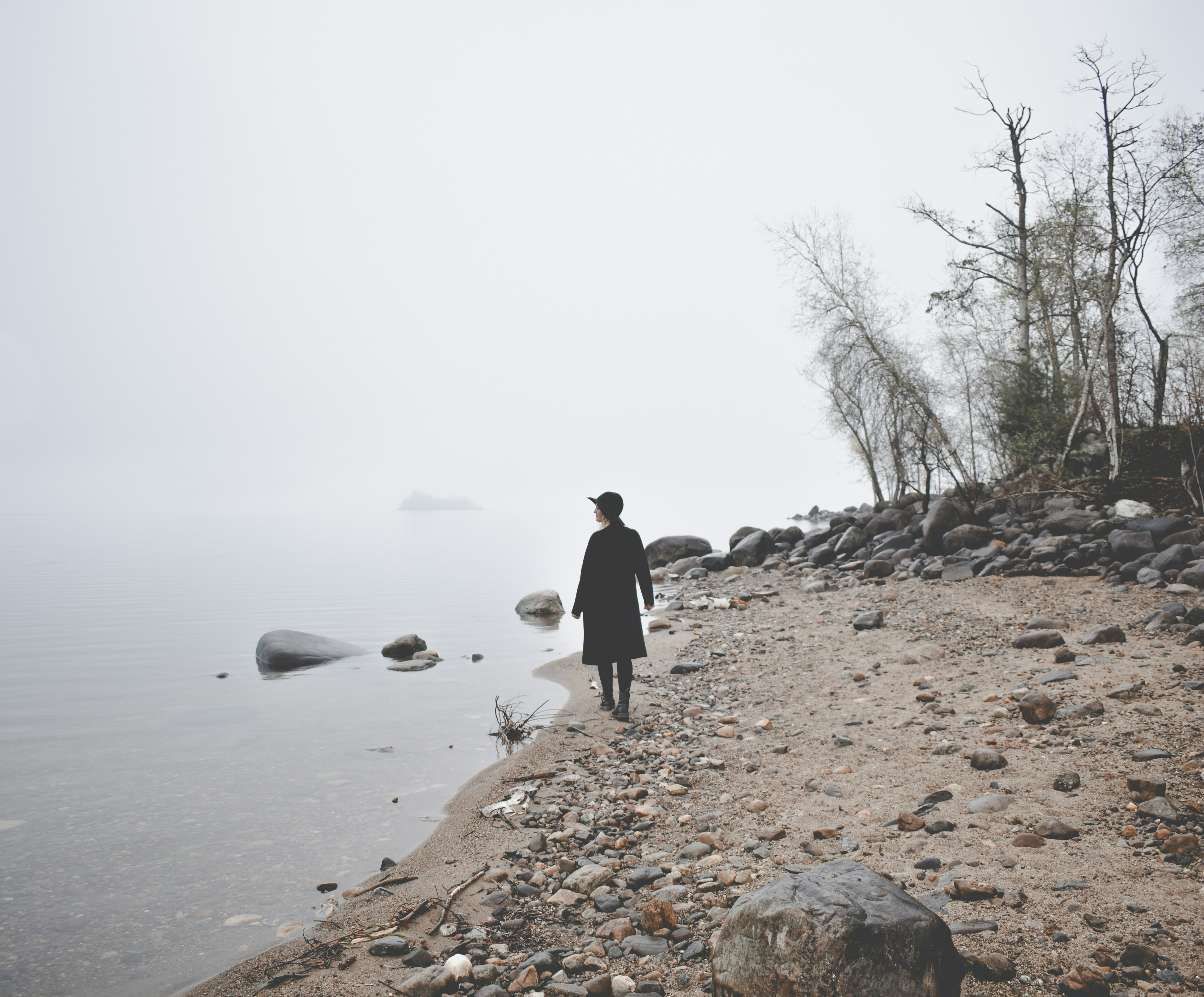 Mist, Pebbles, and a Quiet Figure: A Shoreline Walk in Fog