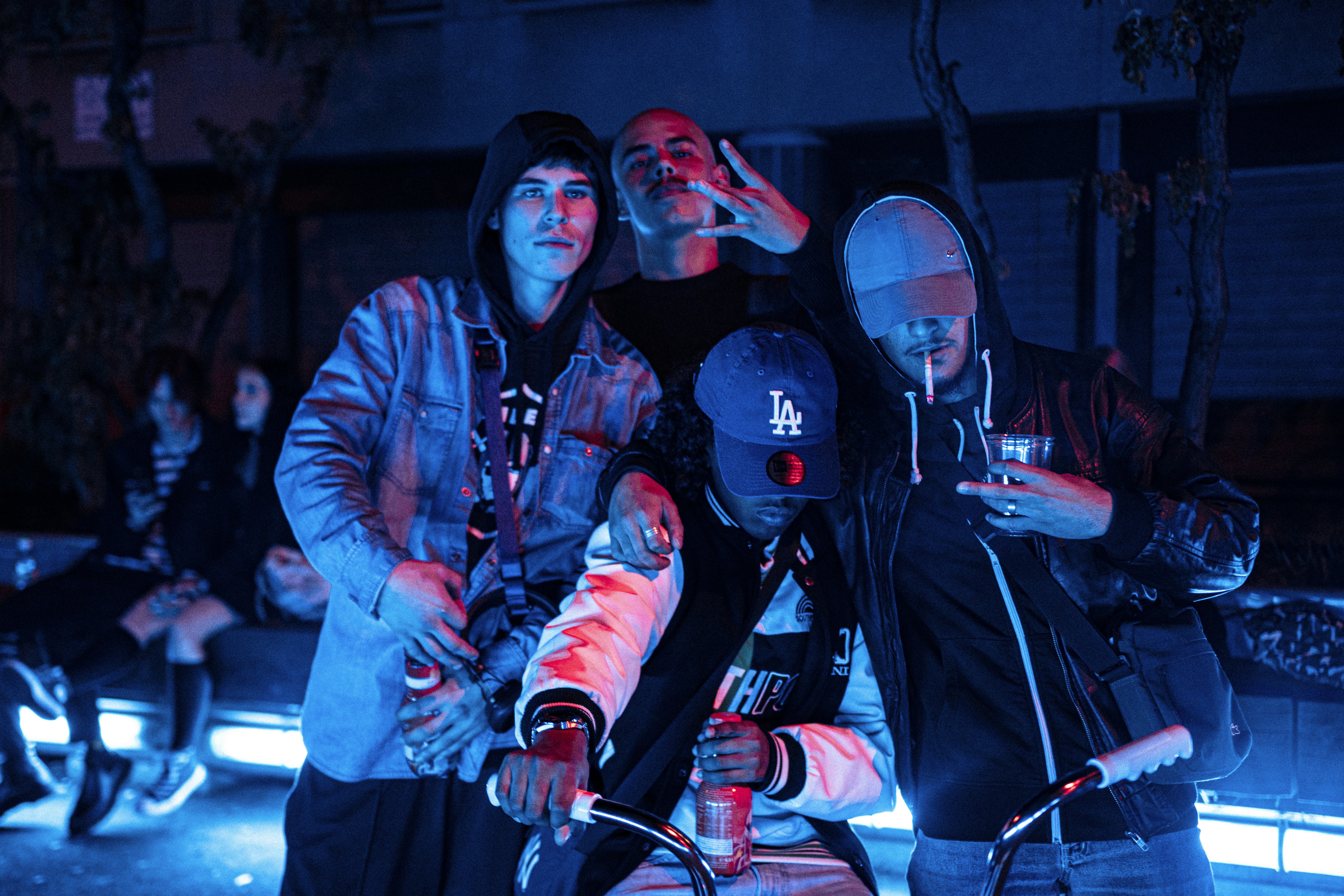 A group of young men standing around each other photo – Free Human ...