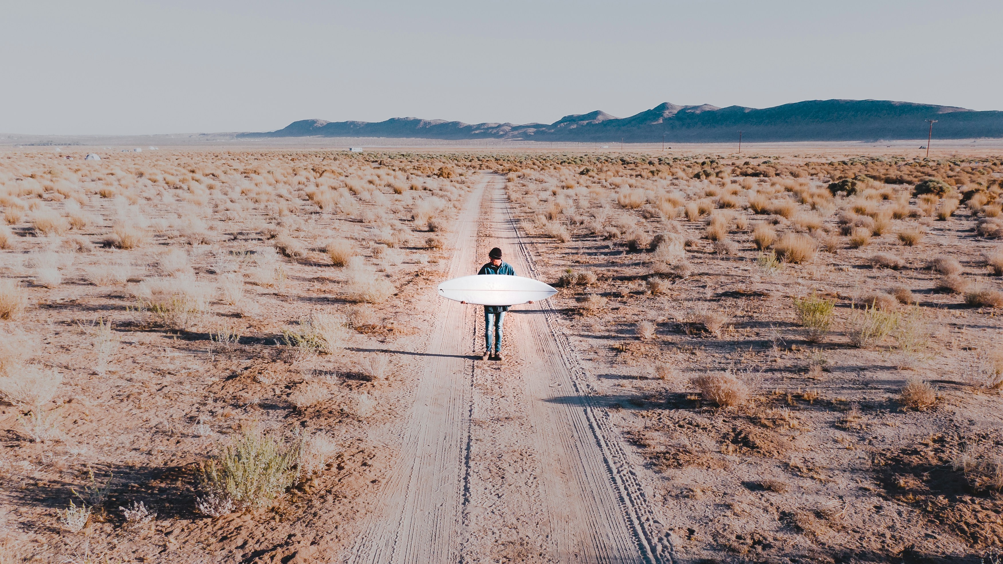 a person riding a bike down a dirt road