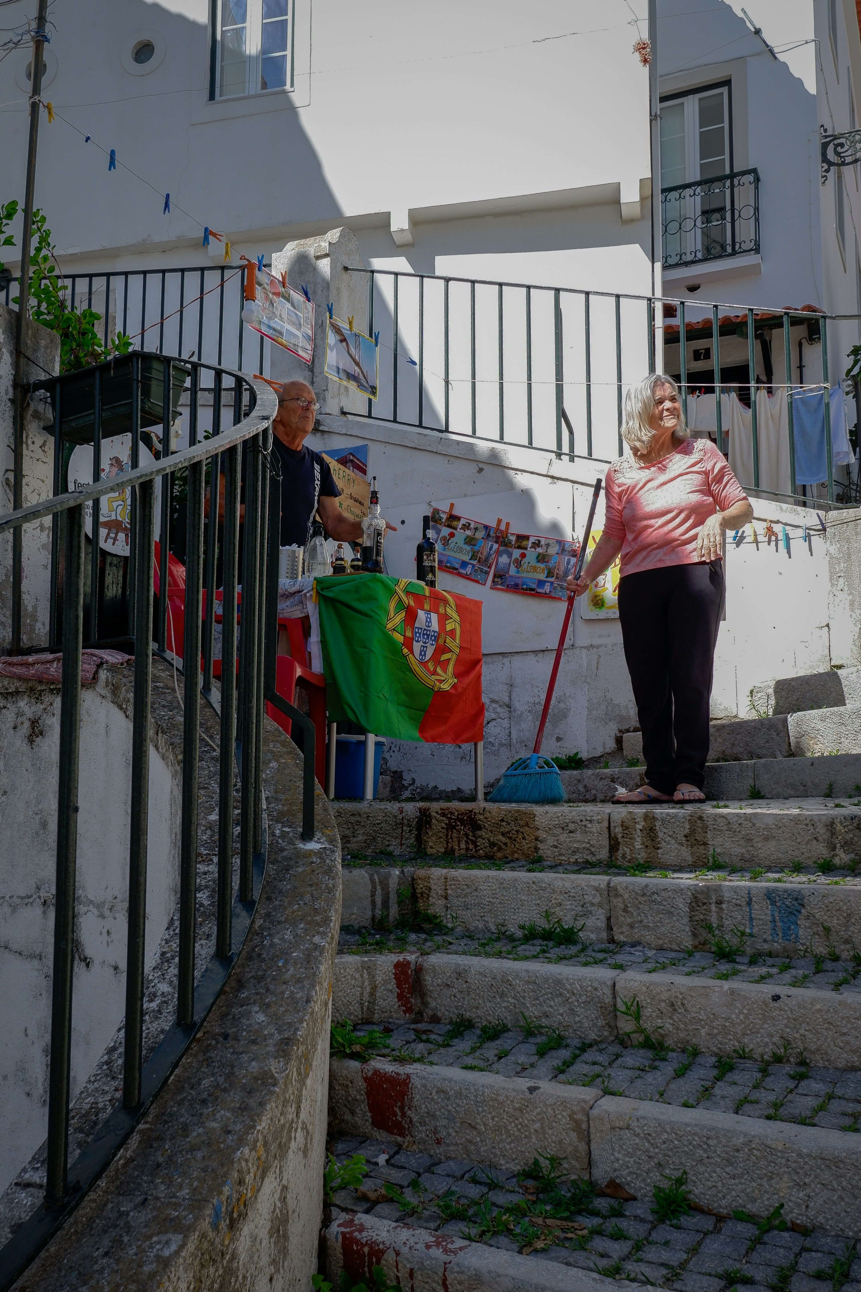 a man and a woman standing on a set of stairs