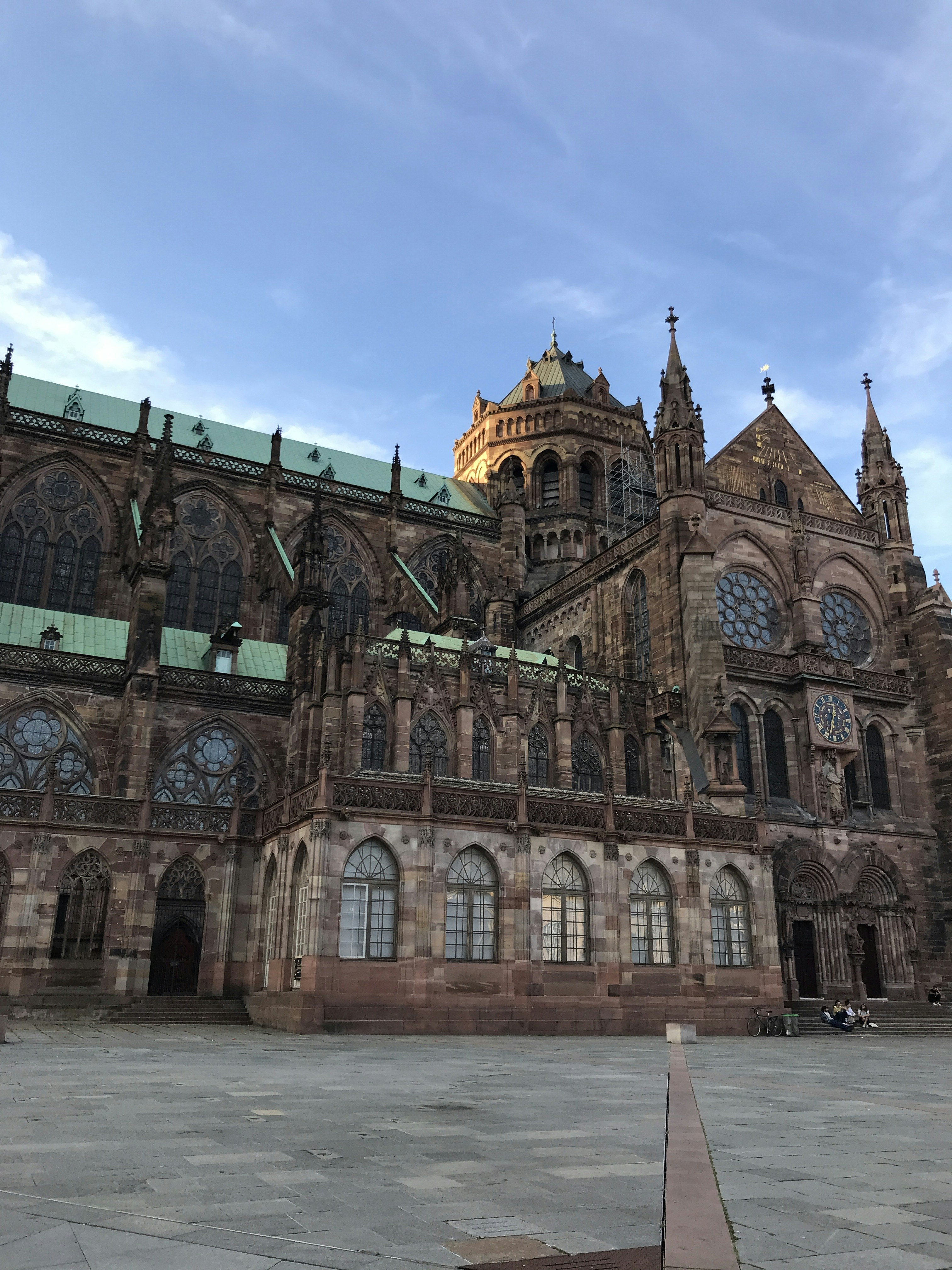 Strasbourg Cathedral Facade: Rose Window and Green Roof under a Clear Sky