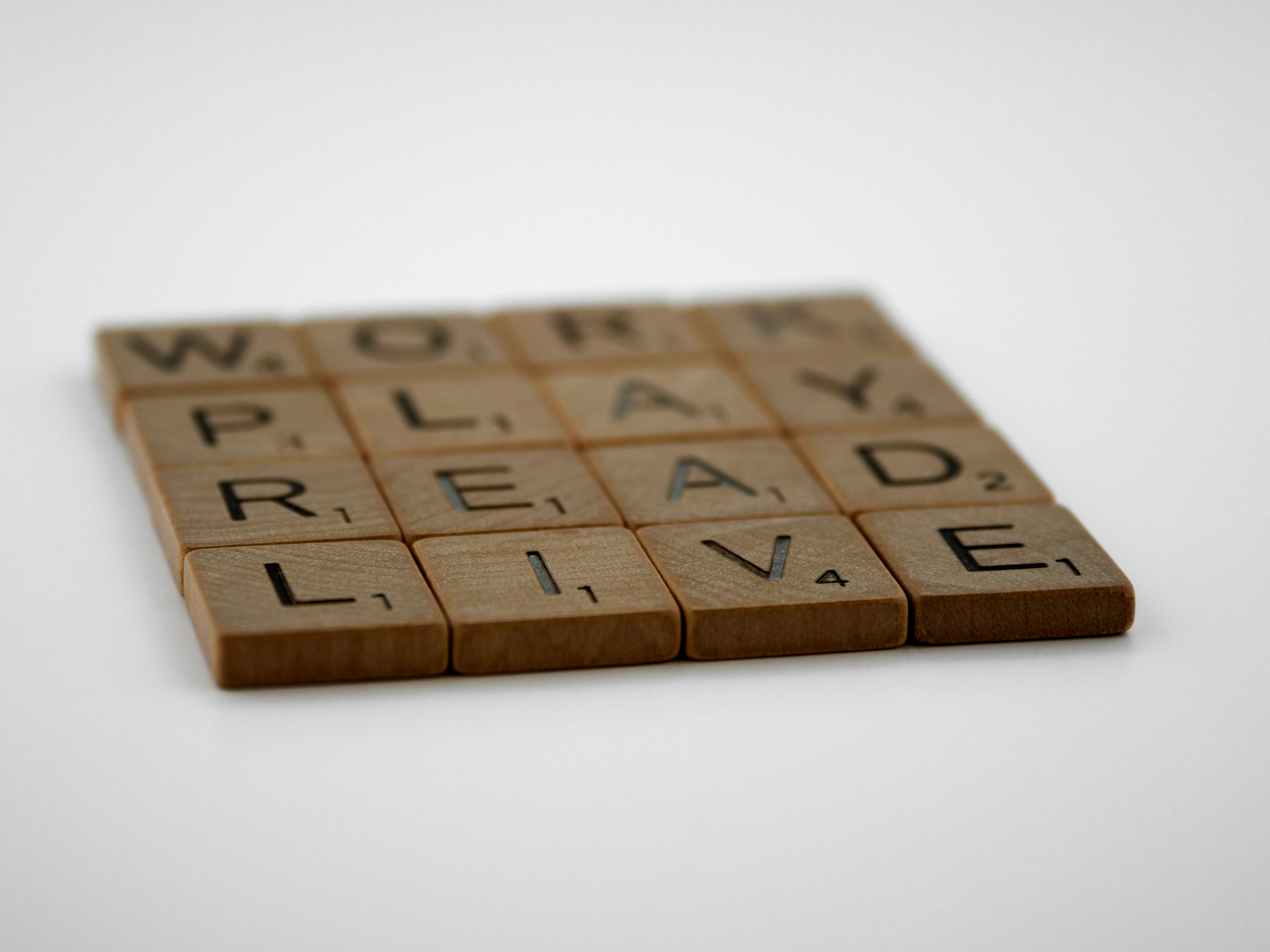A wooden scrabble with words that spell out words photo – Free Game ...