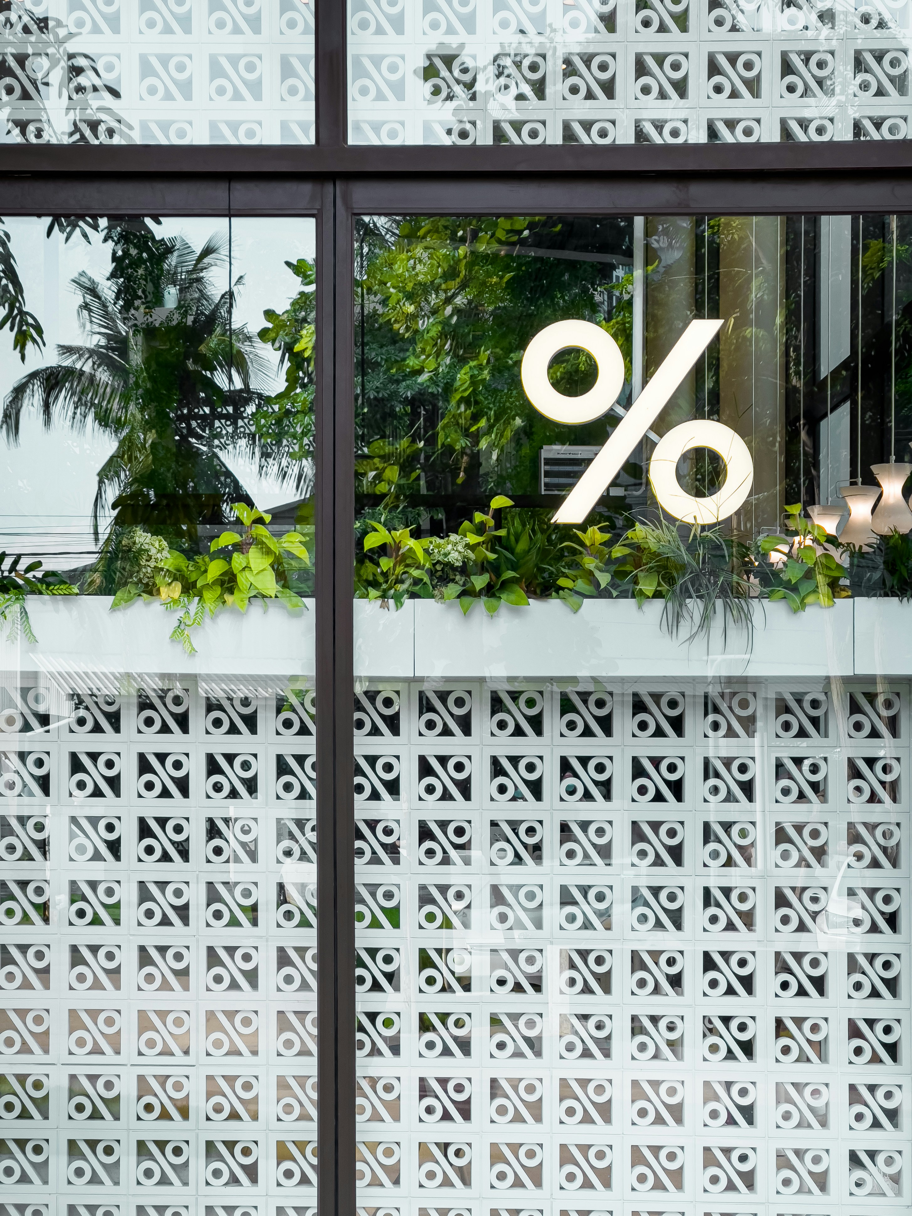 The High Percent Sign Through a Glass Front