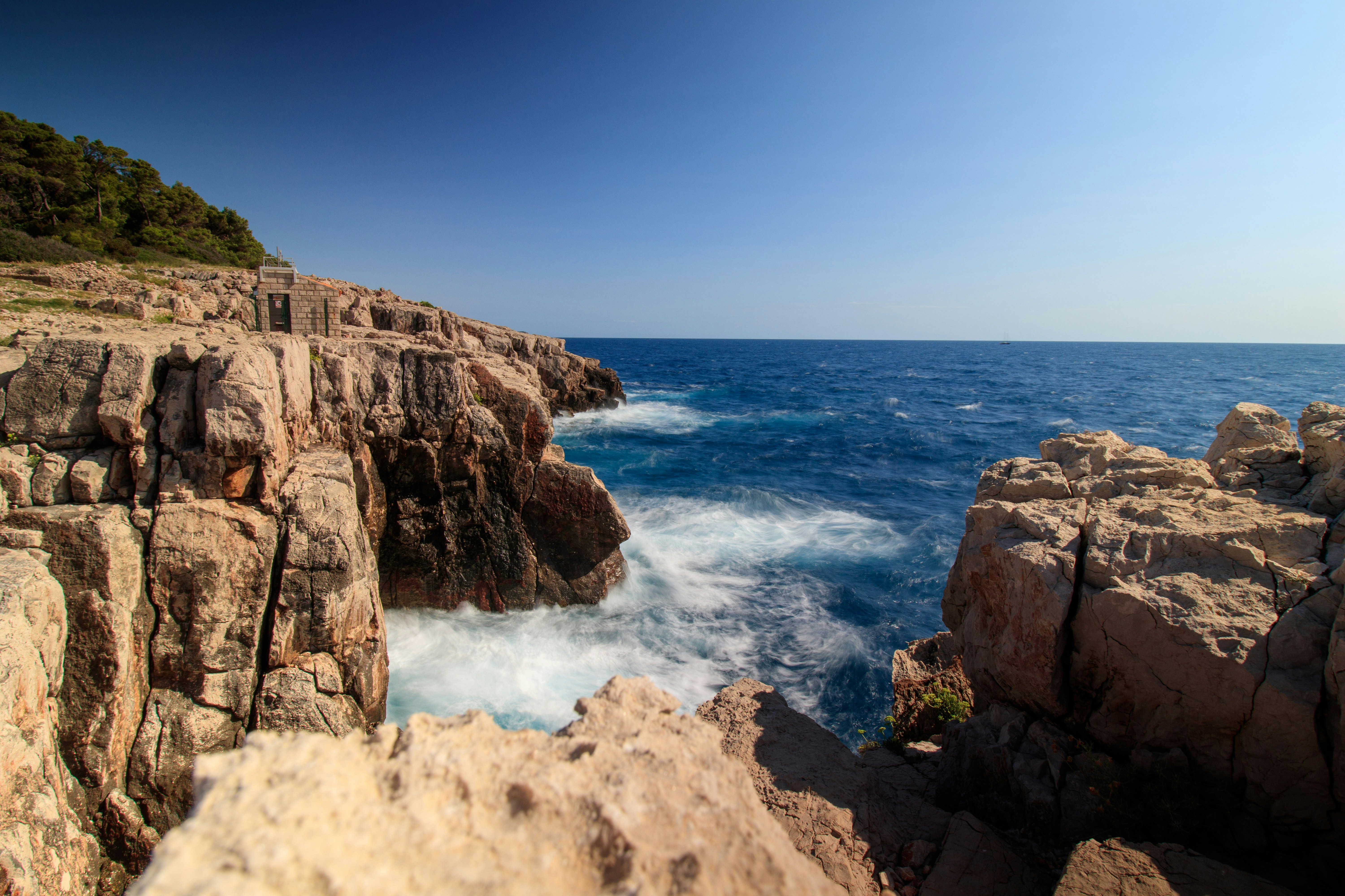 Long exposure shot from Lokrum, Dubrovnik, Croatia. | a view of the ocean from a rocky cliff