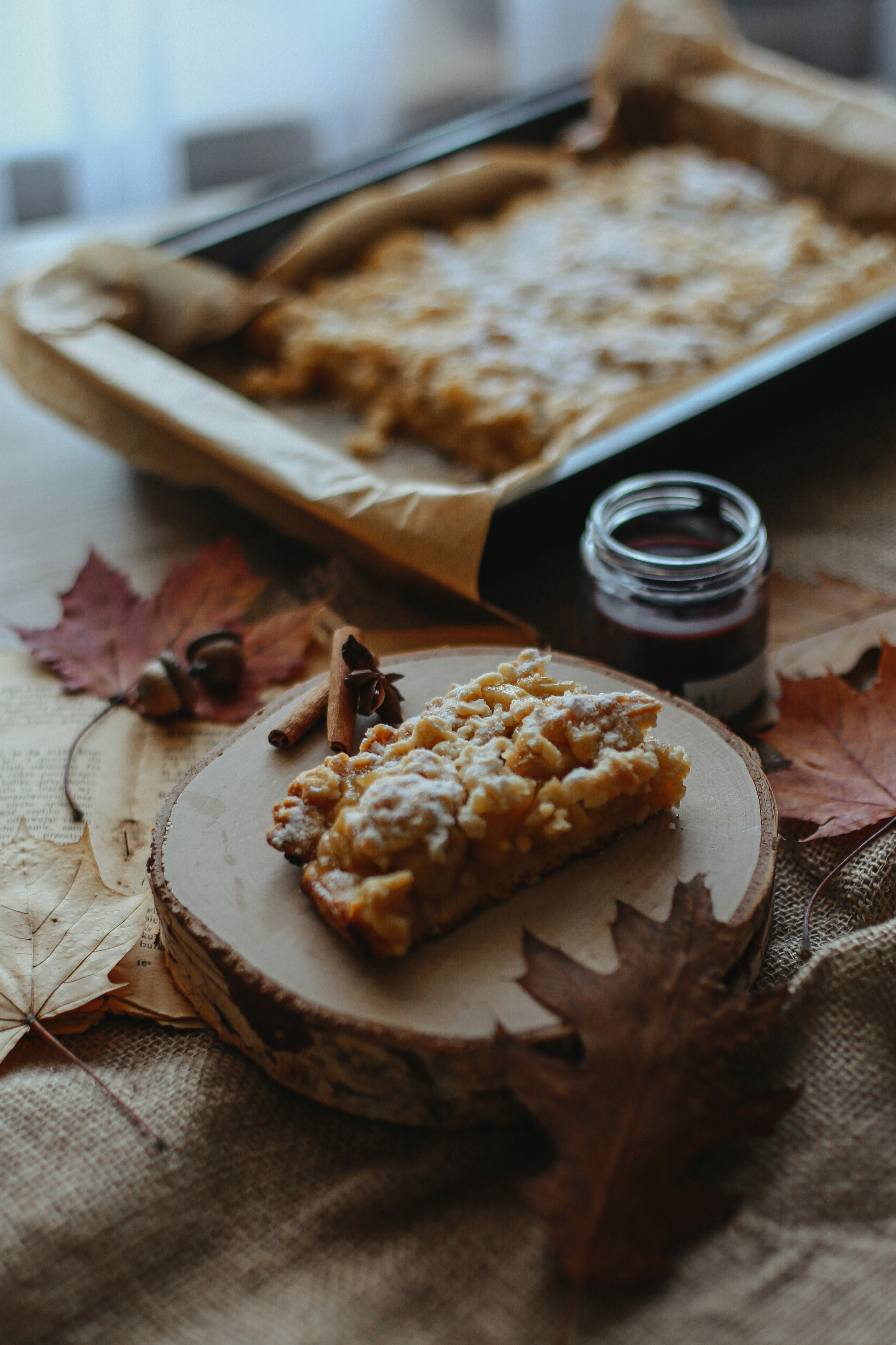 Autumn Crumble on Wood: A Rustic Plate with Jam and Leaves