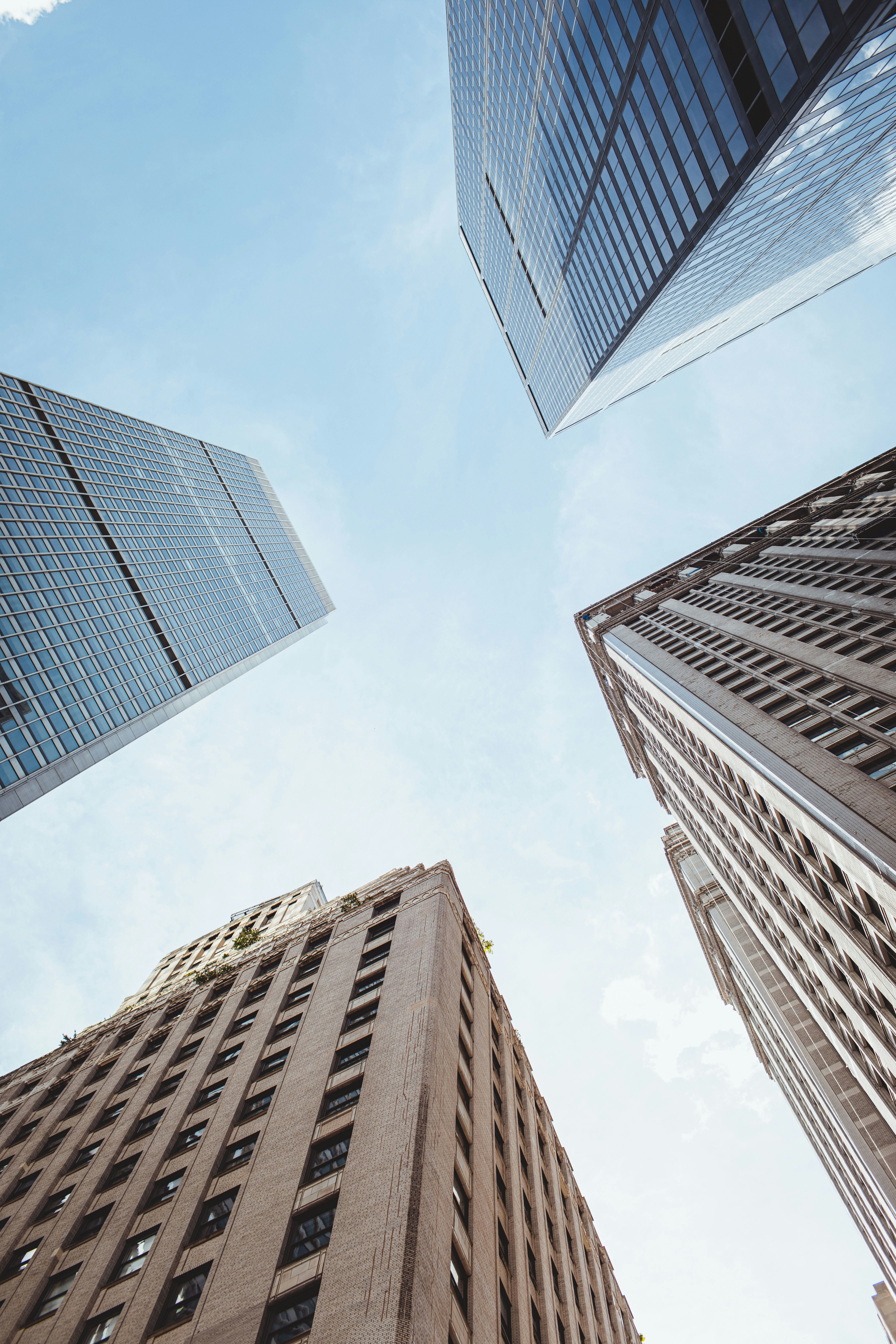 Looking up at tall buildings in a city photo – Free Usa Image on Unsplash