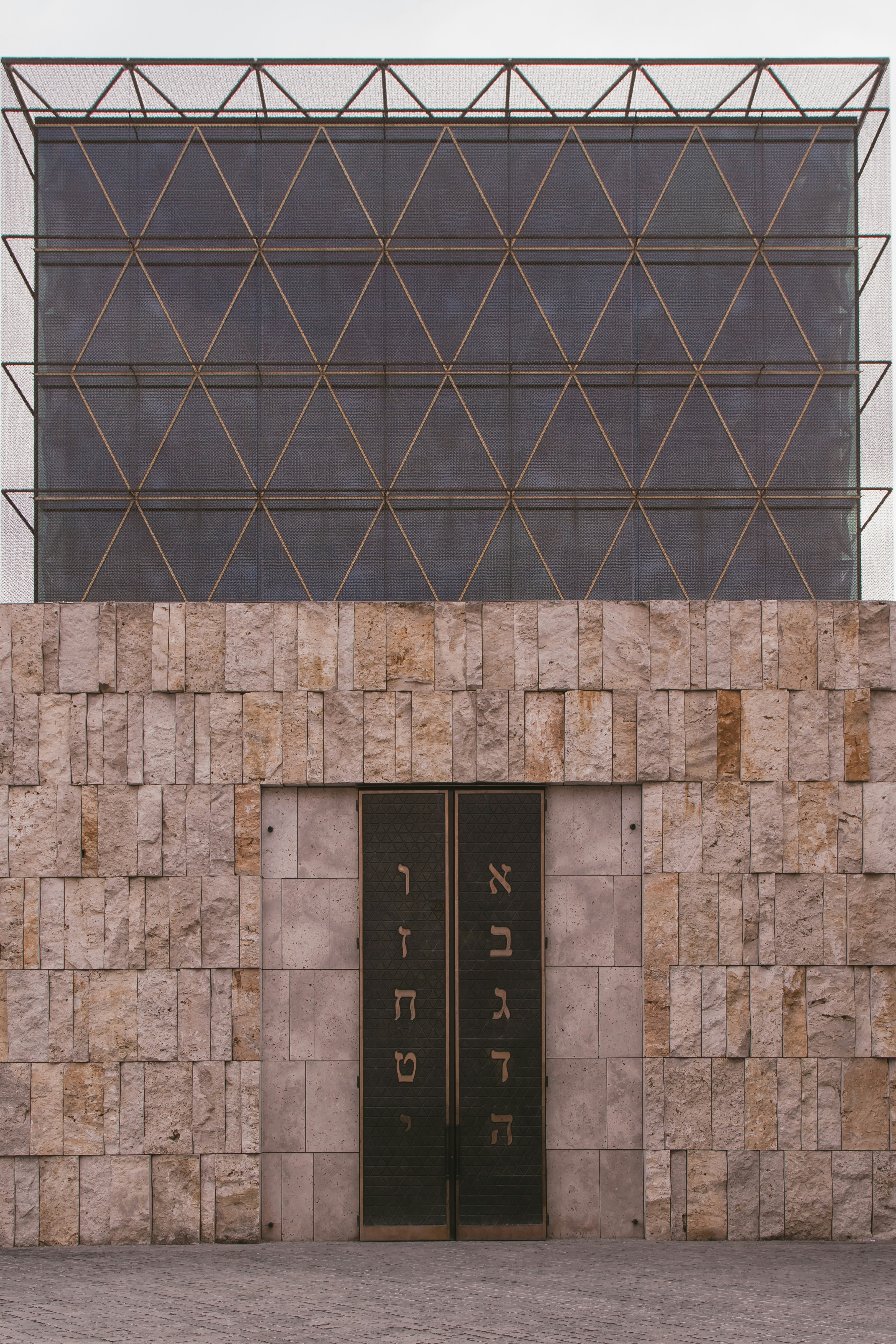 a couple of doors that are in front of a buildingLuca Nicoletti