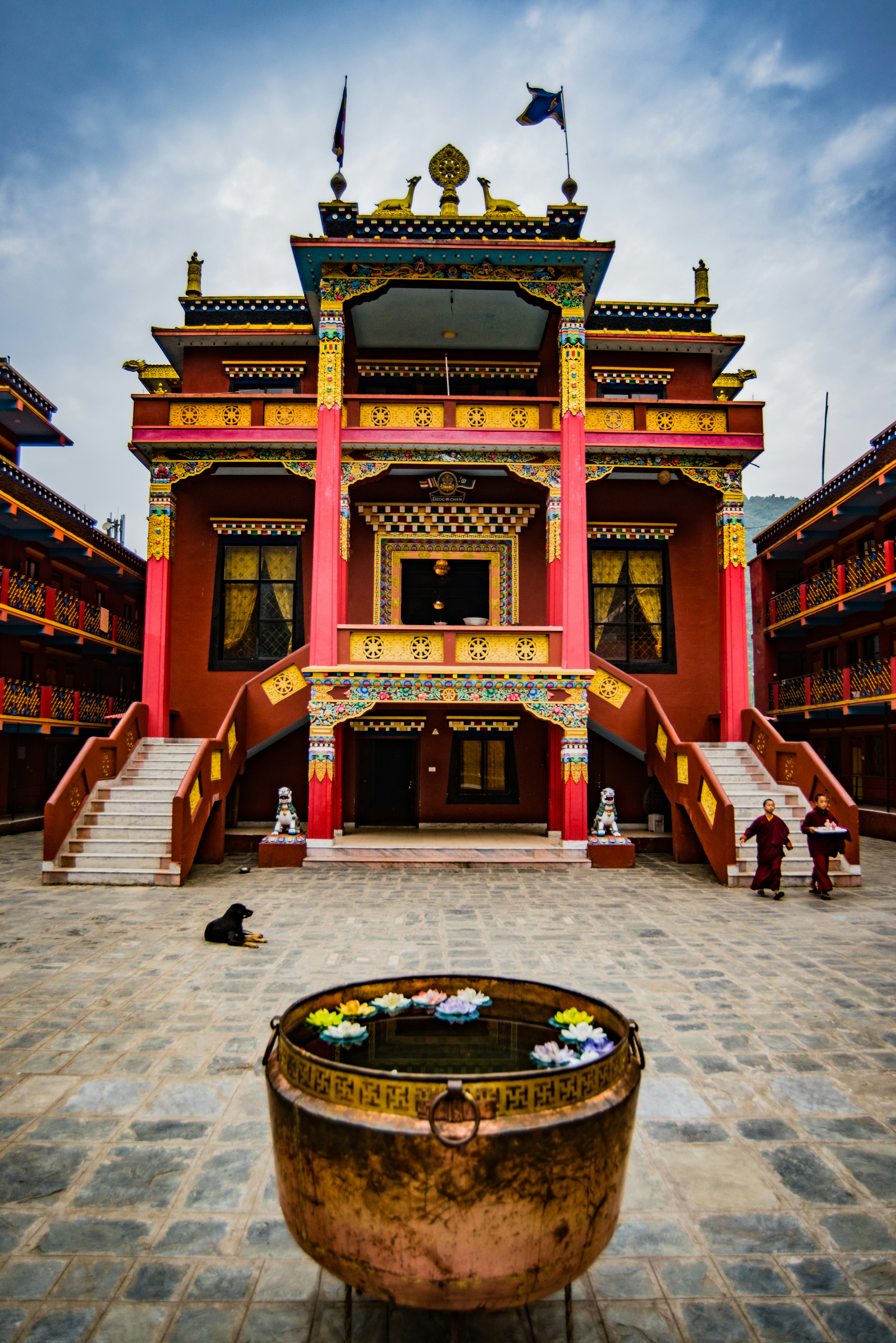 Buddhist monastery close to Kathmandu, Nepal. | a large building with a fountain in front of it