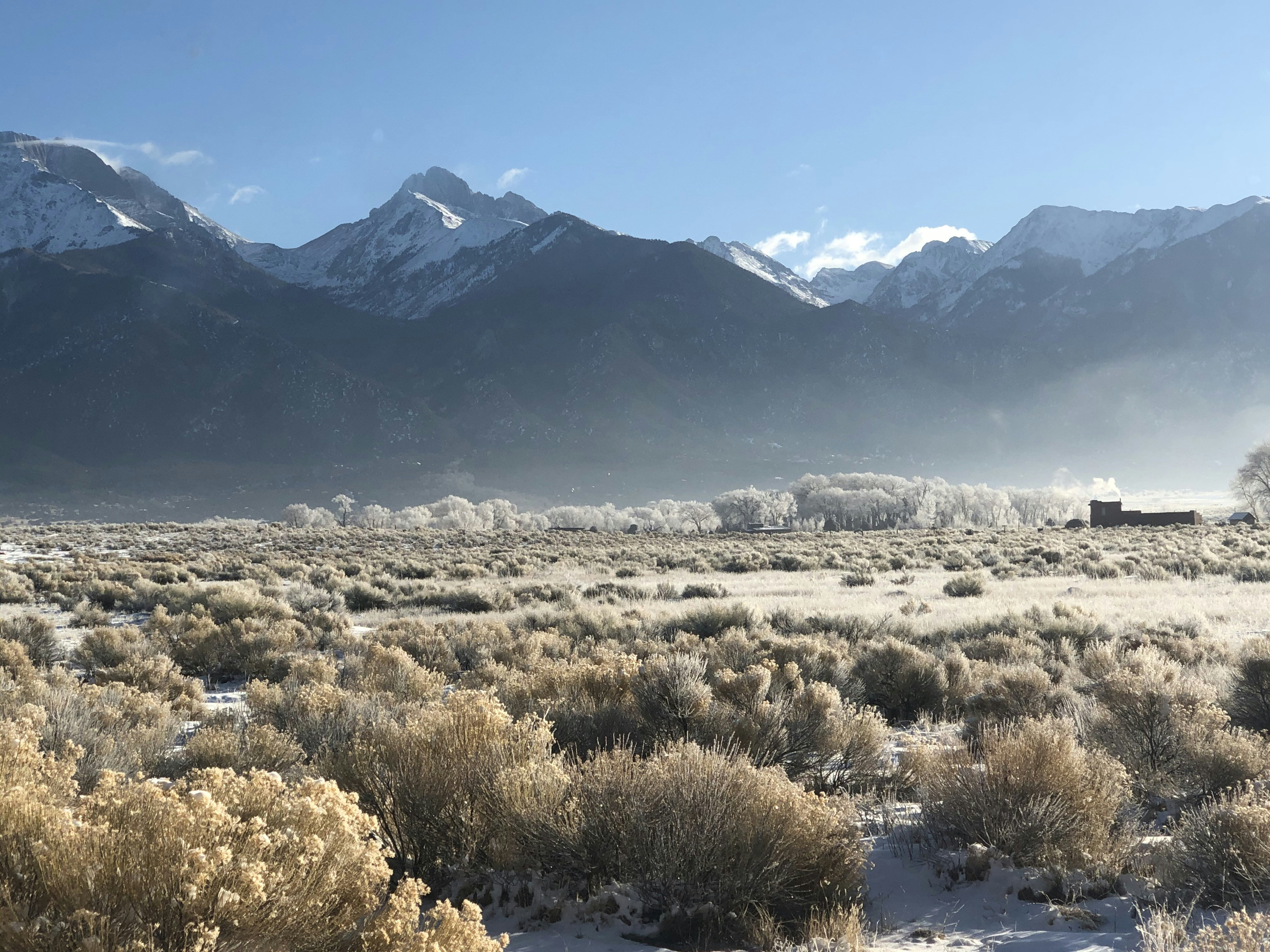 A snowy field with mountains in the background photo – Free Nature ...