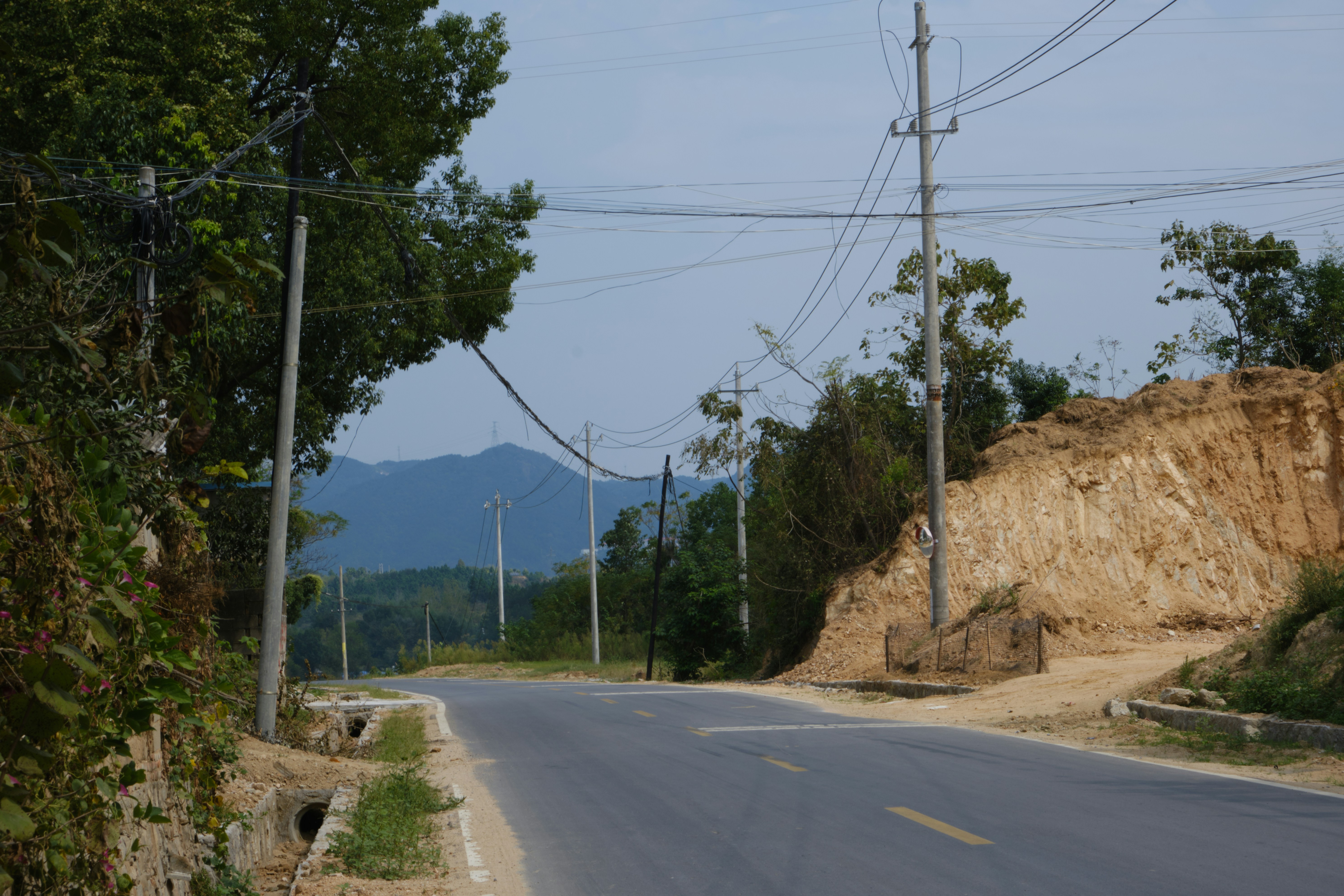 Asphalt Ribbon Toward Distant Blue Hills