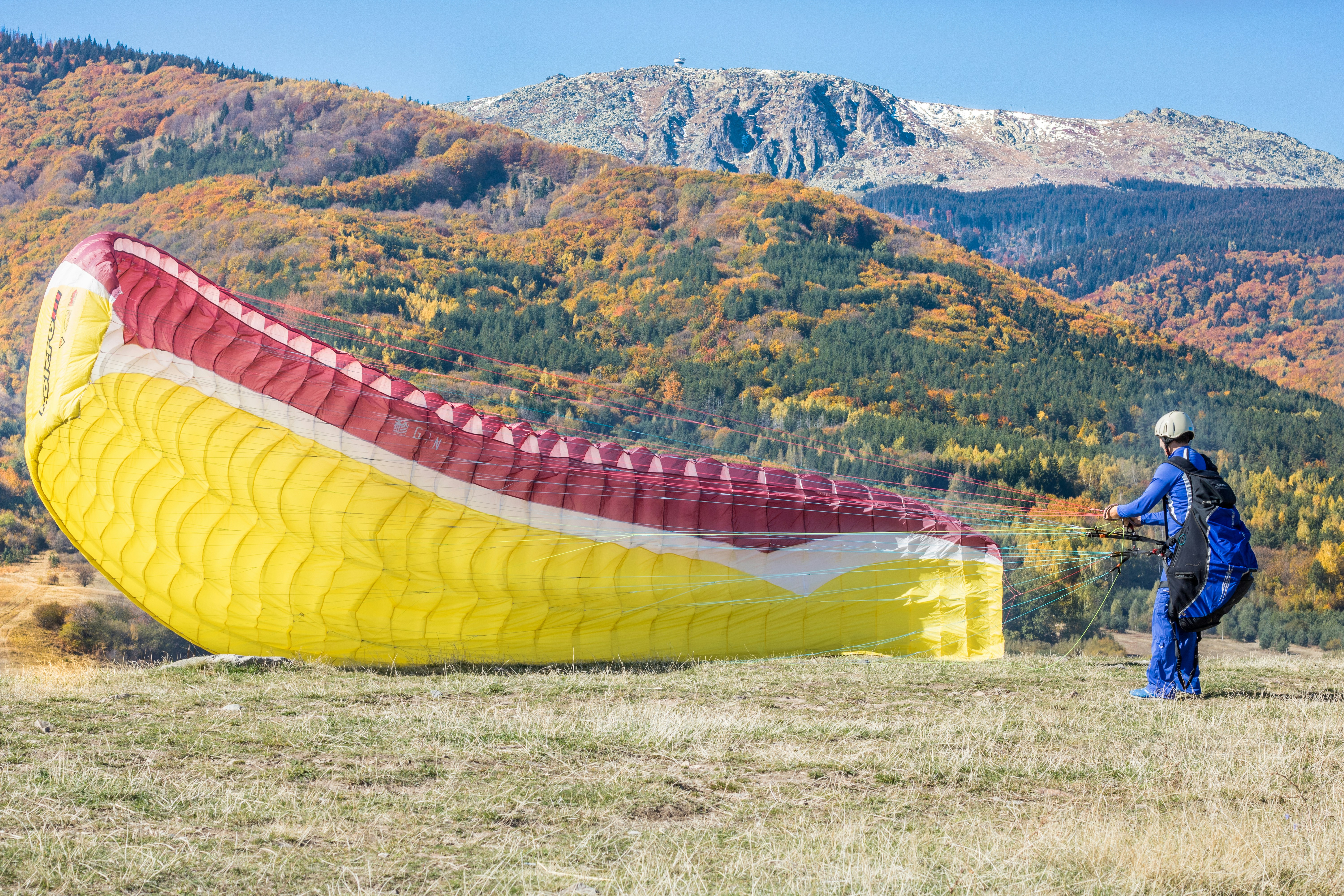 Golden Descent: A Paraglider’s Tailwinds Across Autumn Hills