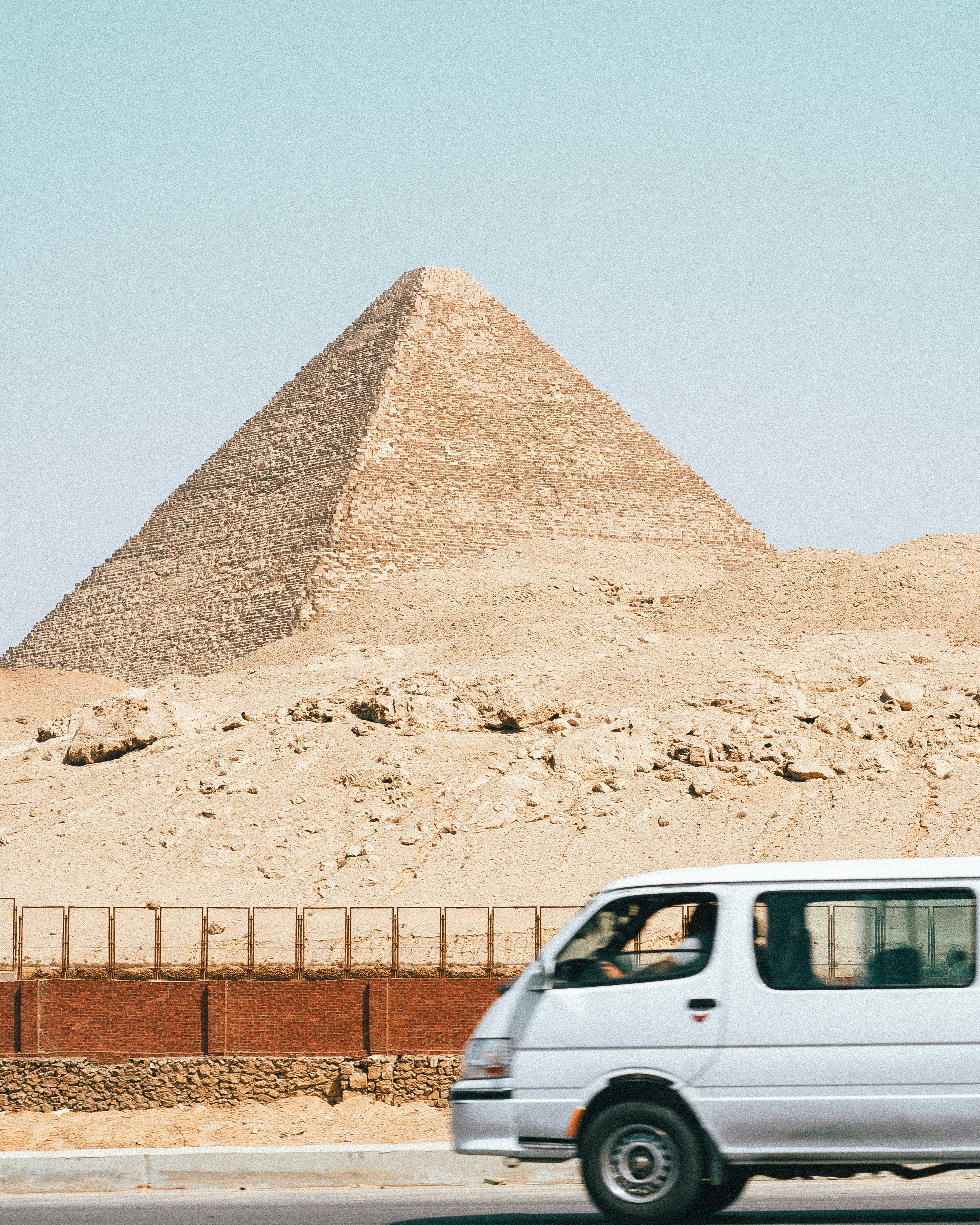 A van driving past a pyramid in the desert photo – Free Giza Image on ...