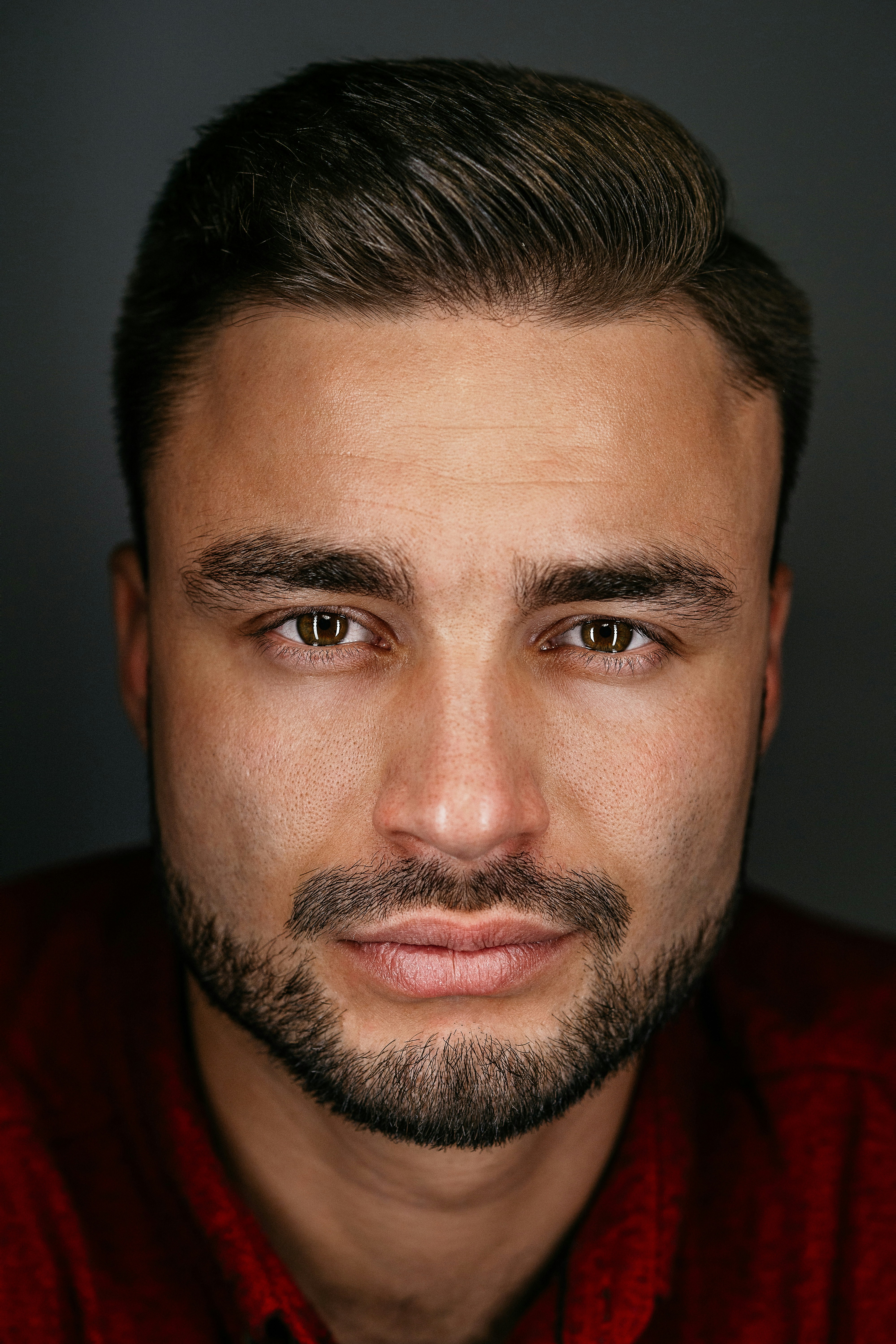 A close up of a person wearing a red shirt photo – Free Black Image on ...