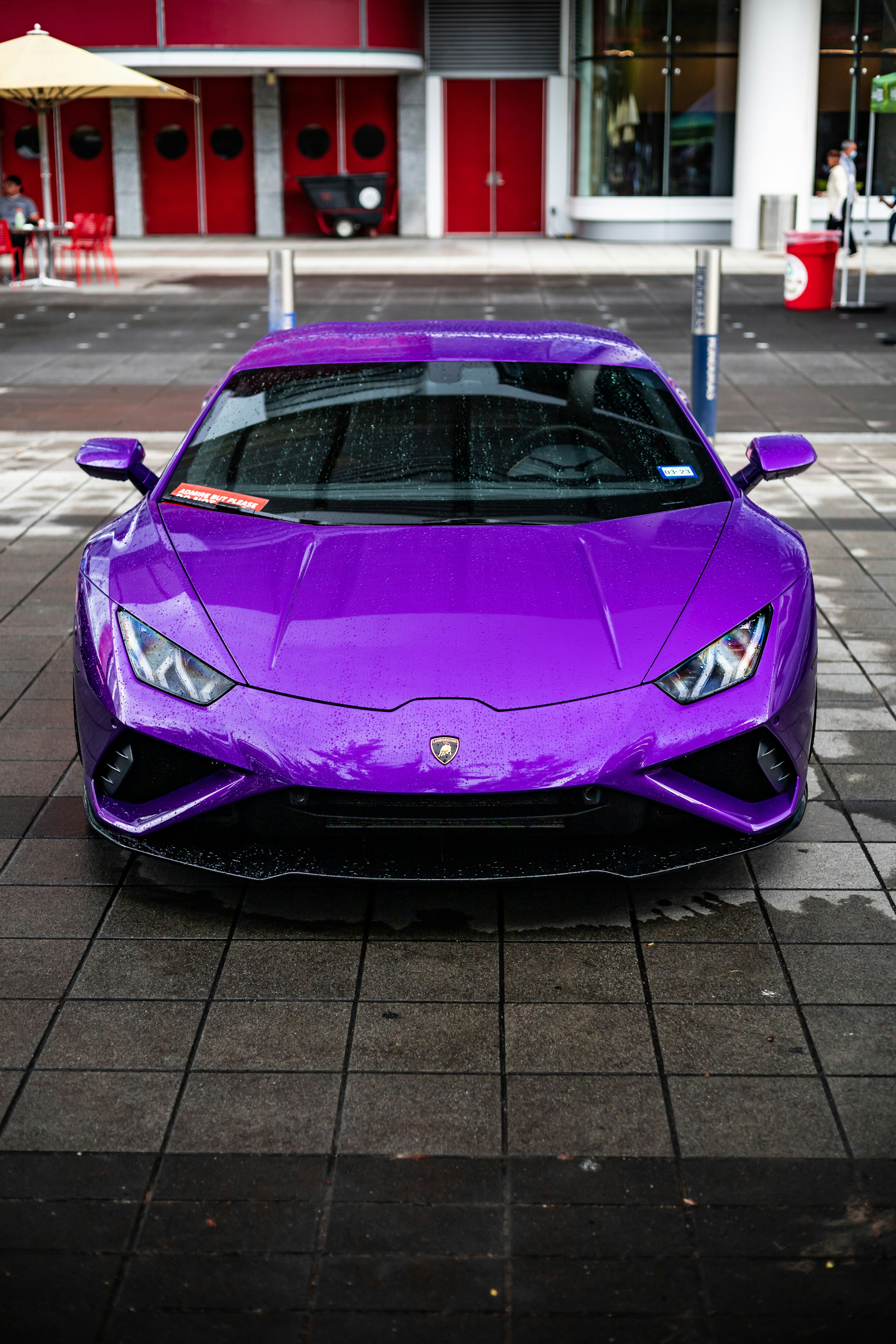 A purple sports car parked in front of a building photo – Free Usa ...