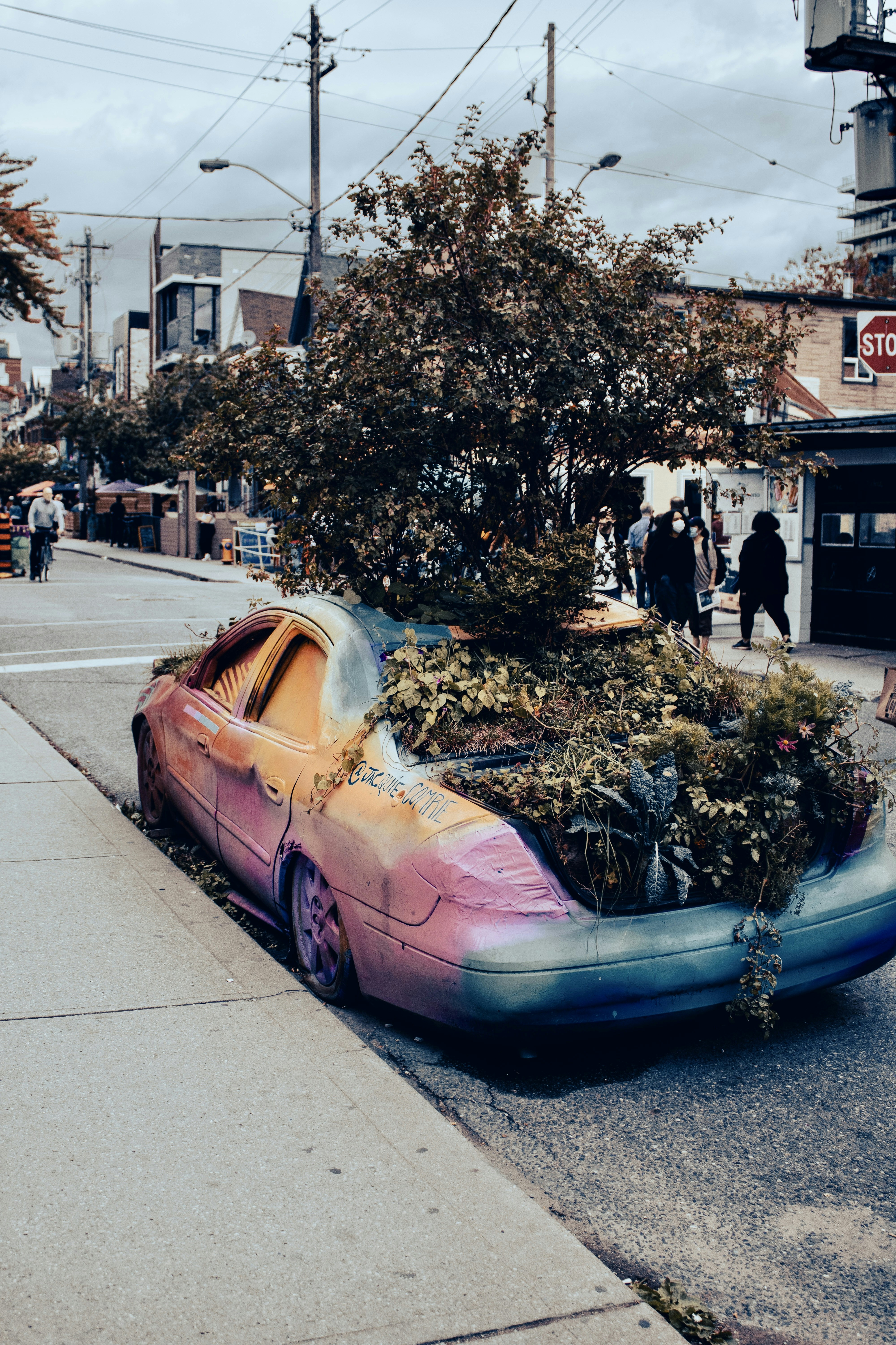 an inflatable car is parked on the side of the road