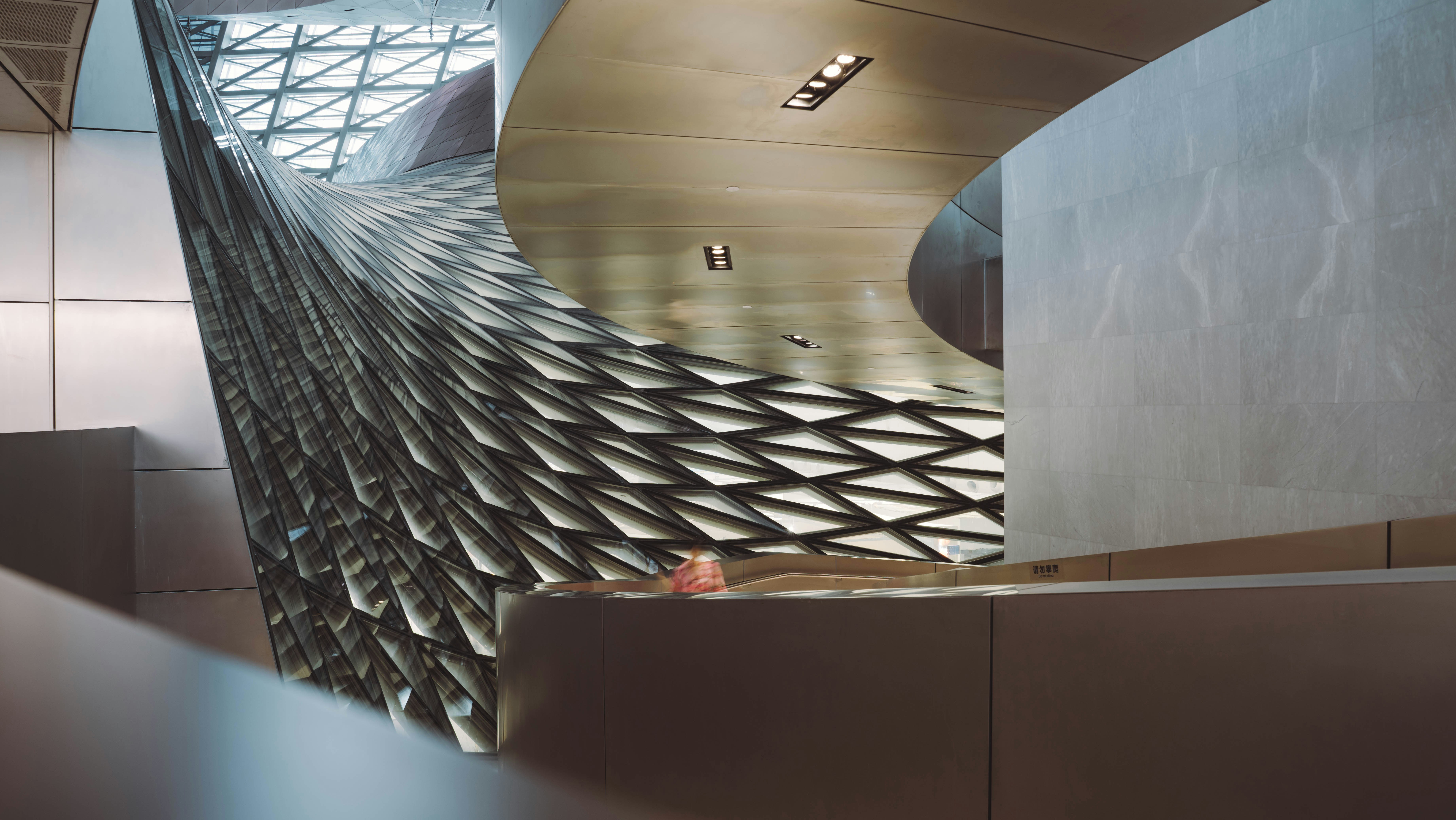 A modern building with a curved metal wall photo – Free Shenzhen Image ...