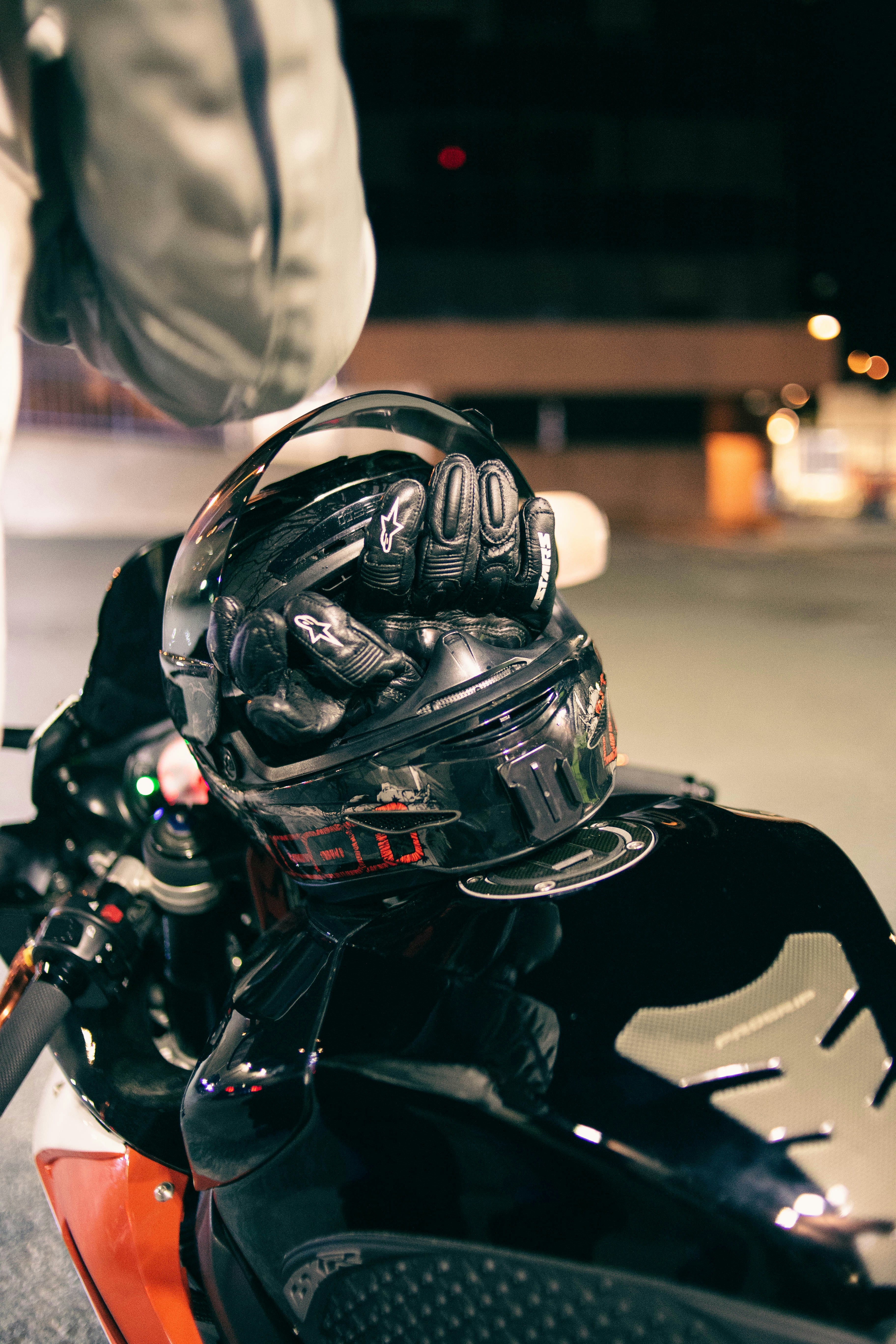 A person wearing a helmet sitting on a motorcycle photo – Free Helmet ...