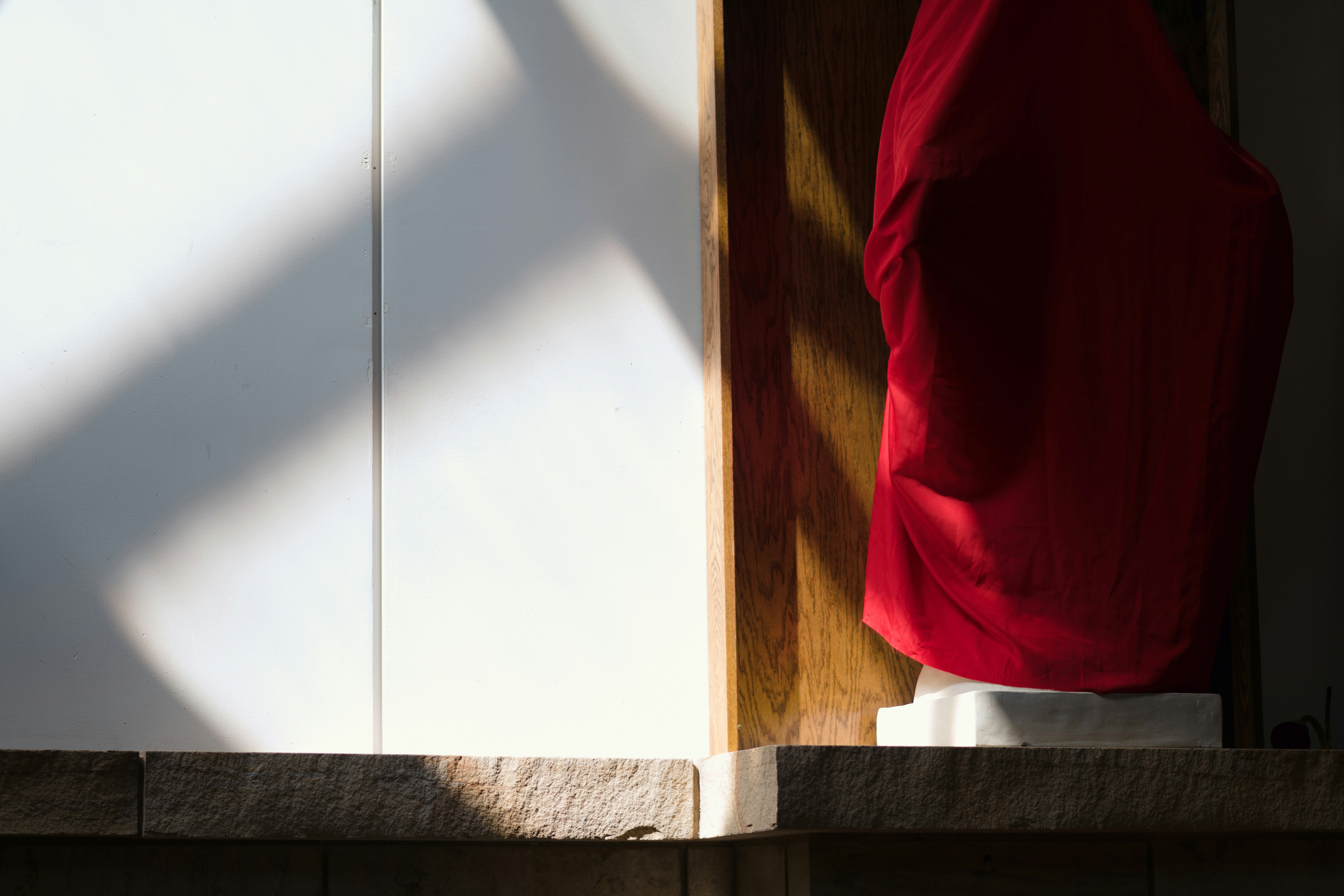 A wooden door with a red cloth draped over it photo – Free Human Image ...
