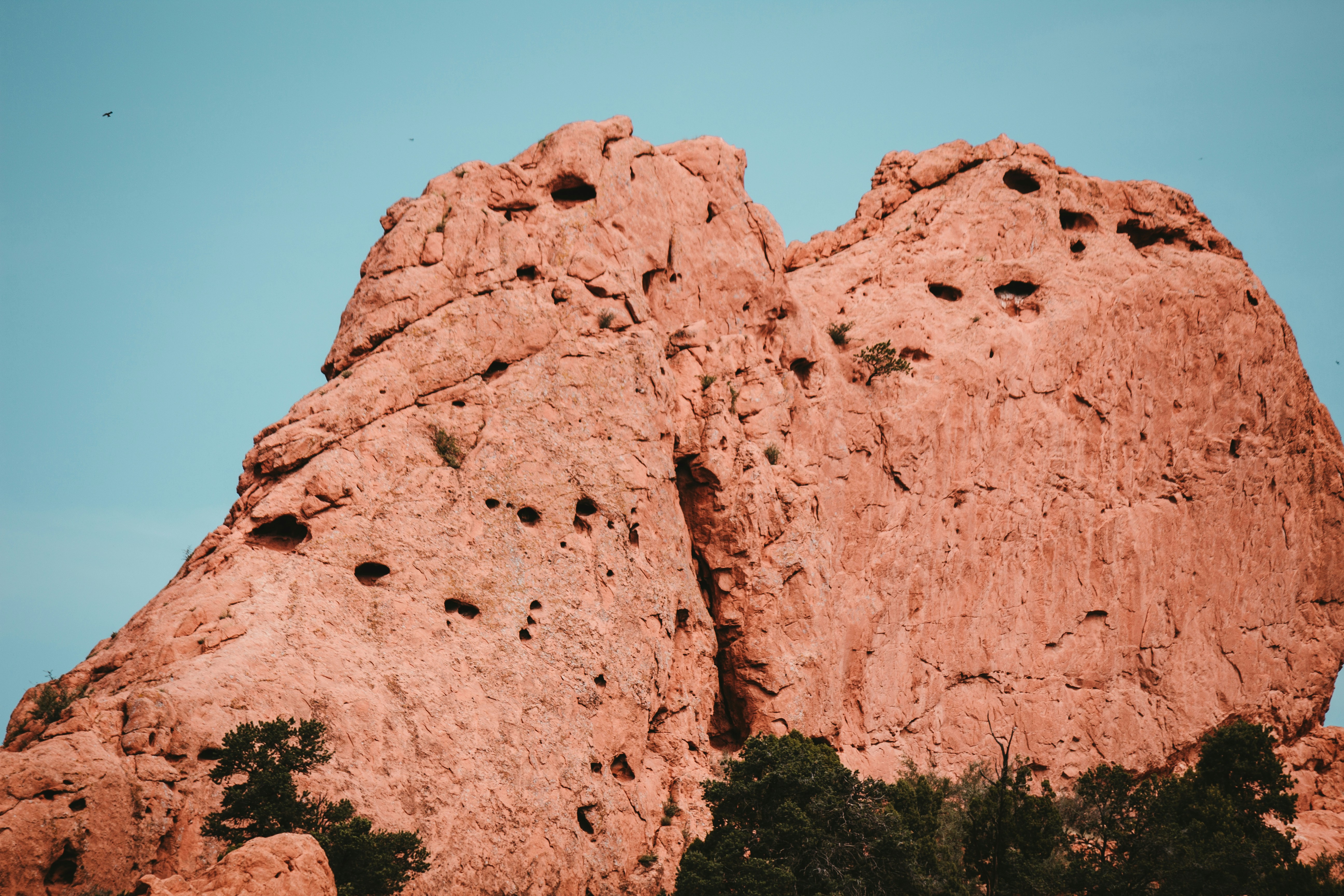 Twin Crimson Rock Towers Carved by Time Under a Clear Blue Sky