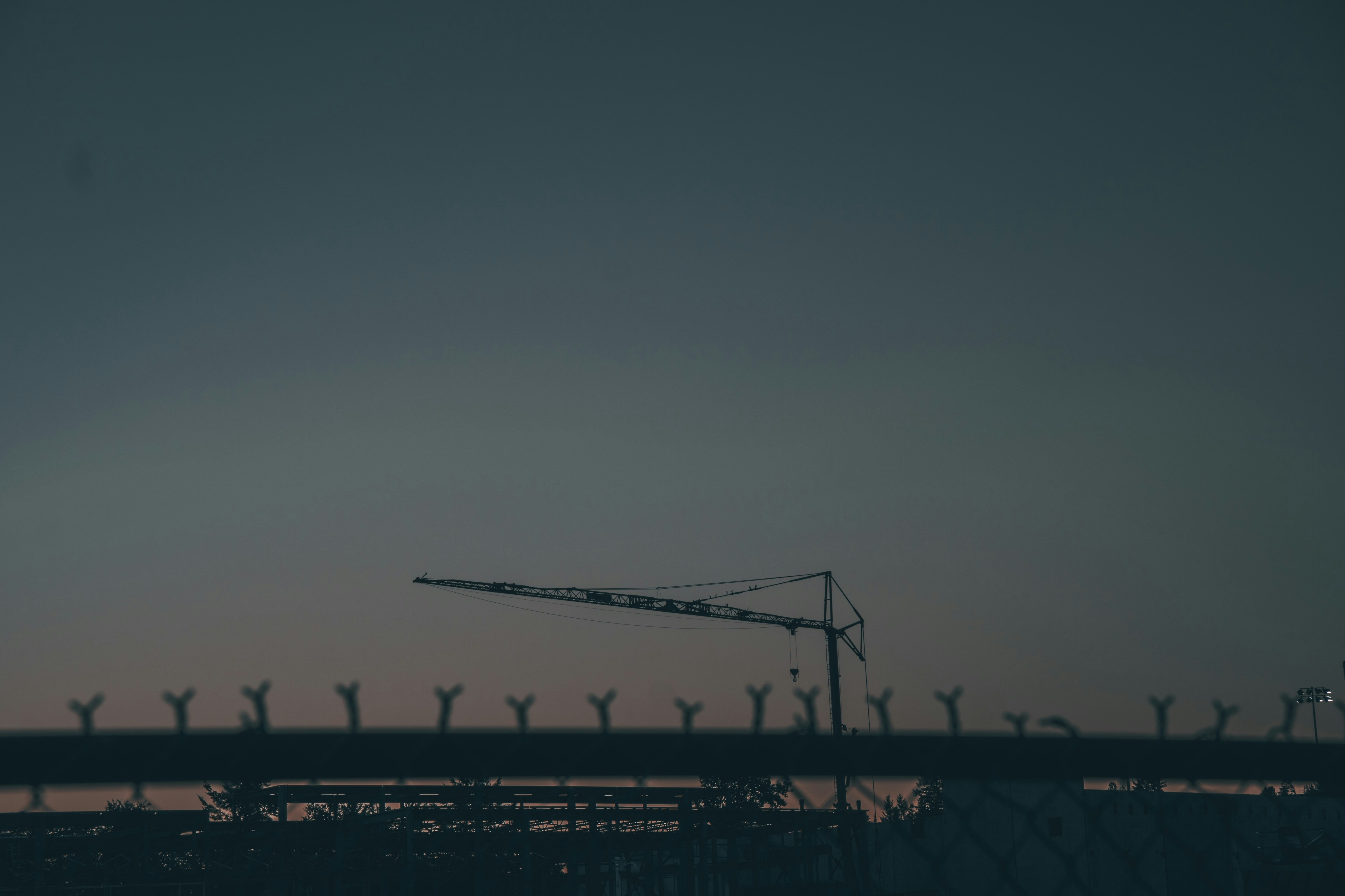 Railing Silhouette Under a Wide Sky
